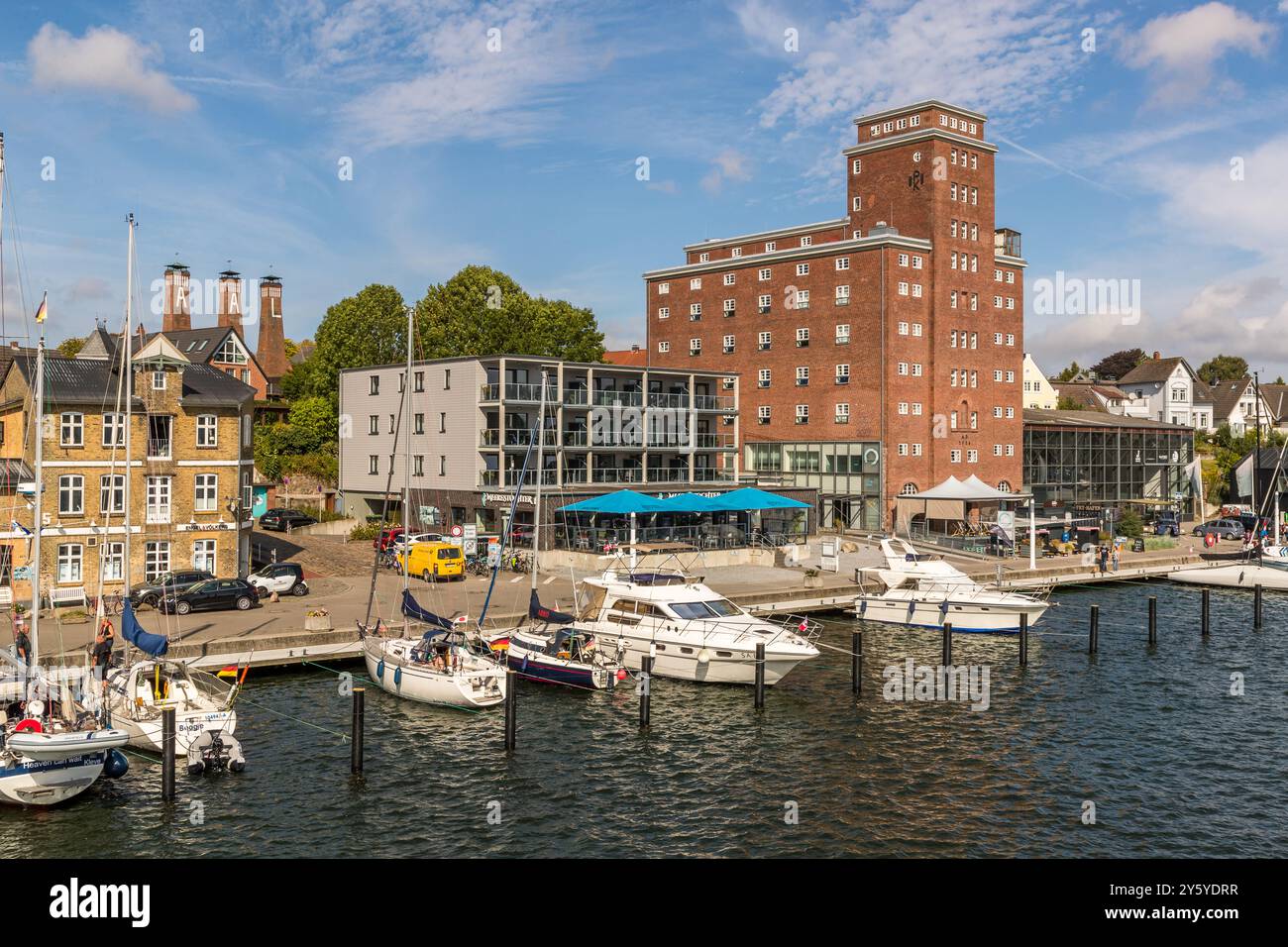 View of the harbor of Kappeln with towers of the Föh smokehouse and the ...