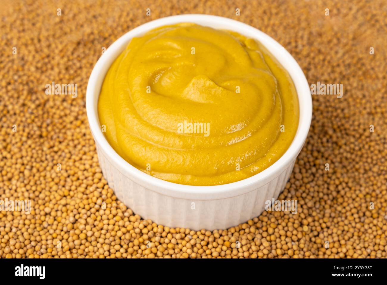 Mustard sauce and dry mustard seeds Stock Photo - Alamy