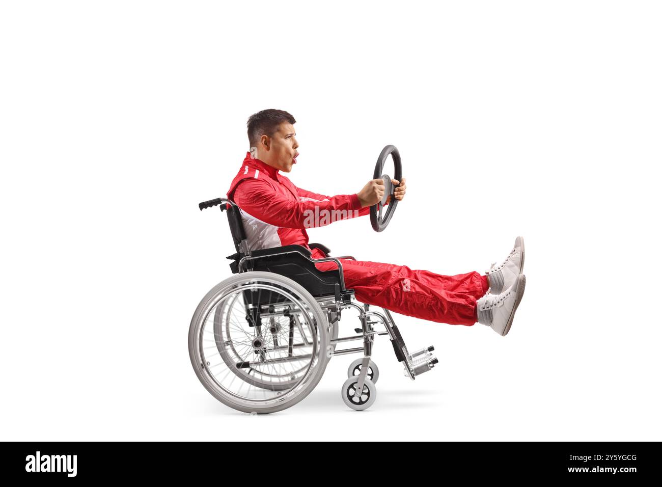 Car racer in a wheelchair holding a steering wheel and riding fast ...