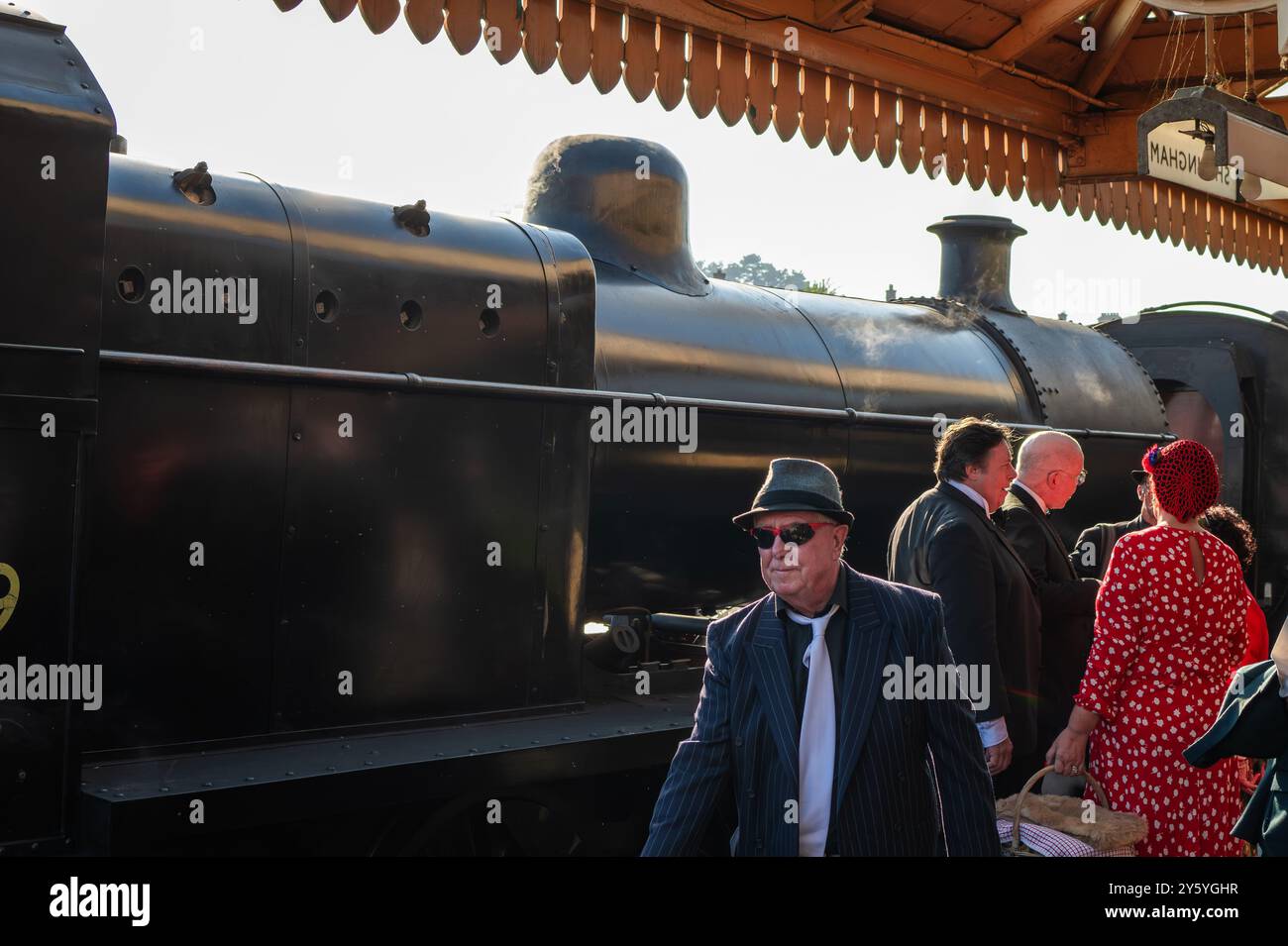 Sheringham, Norfolk, UK - SEPTEMBER 21 2024: Old guy with glasses and ...