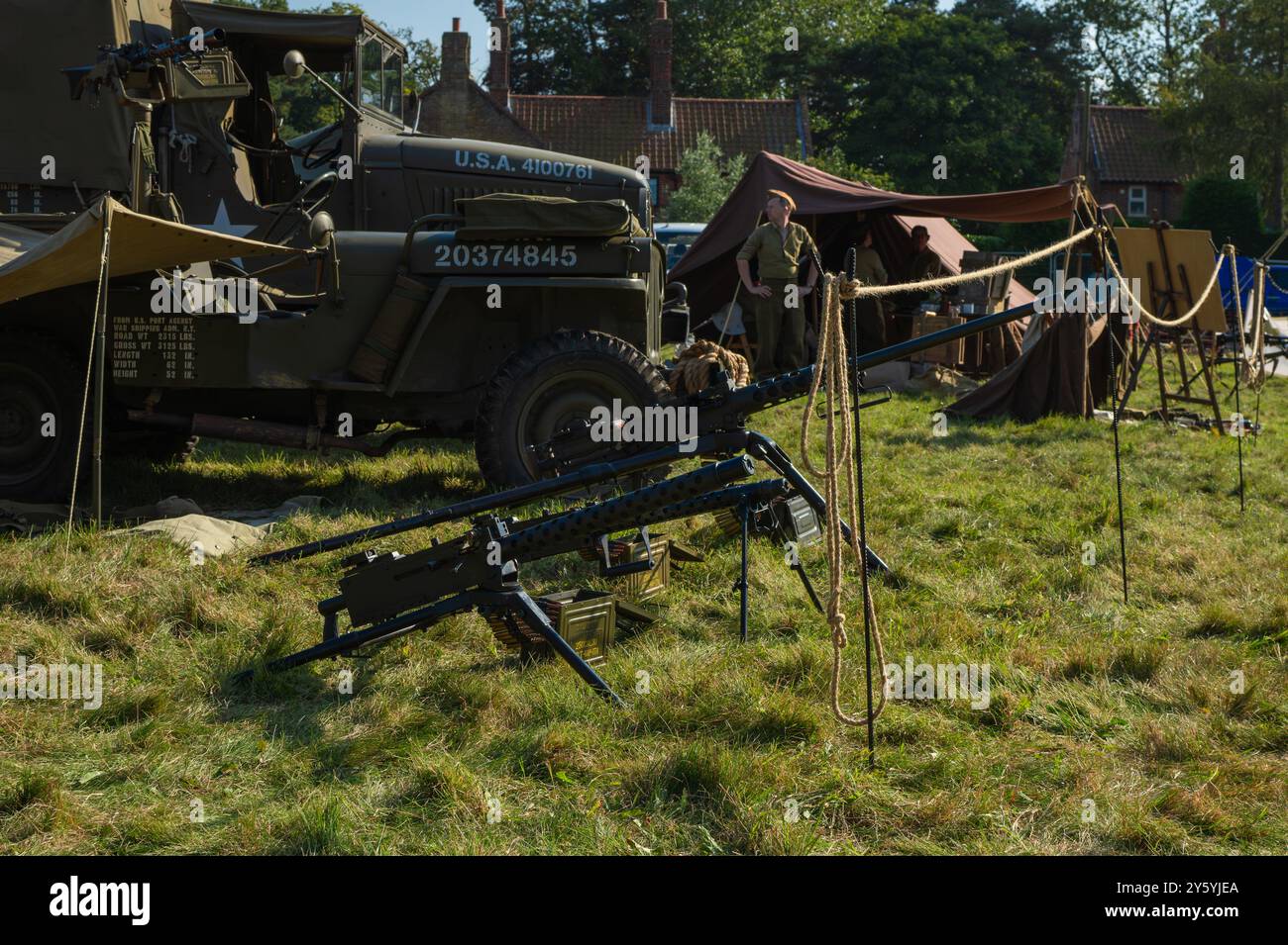 Holt, Norfolk, UK - SEPTEMBER 21 2024: WWII machine guns on grass next ...