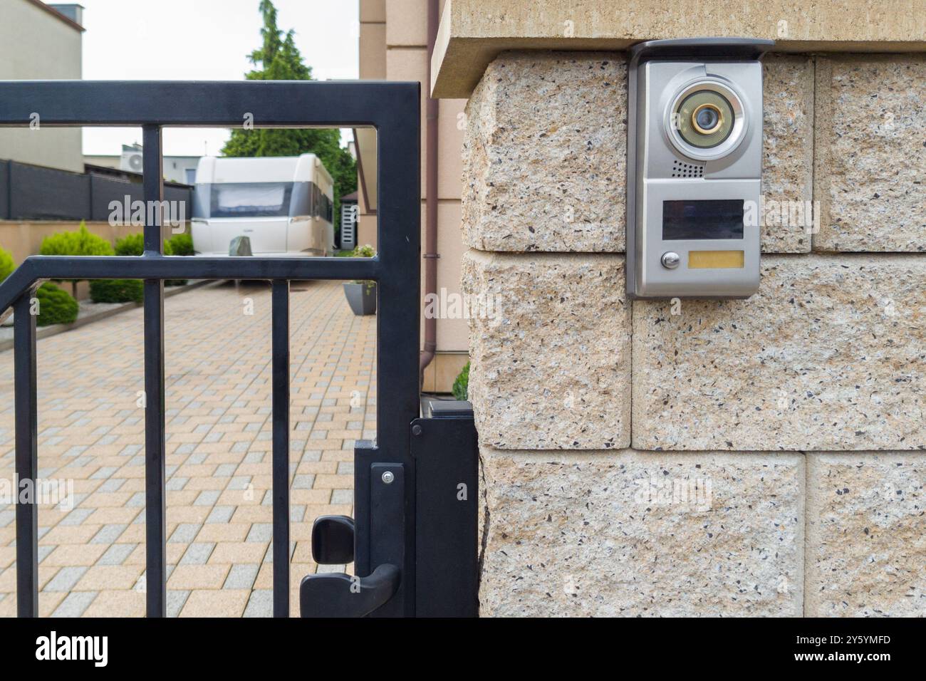 Gated driveway with video intercom system and caravan parked Stock ...