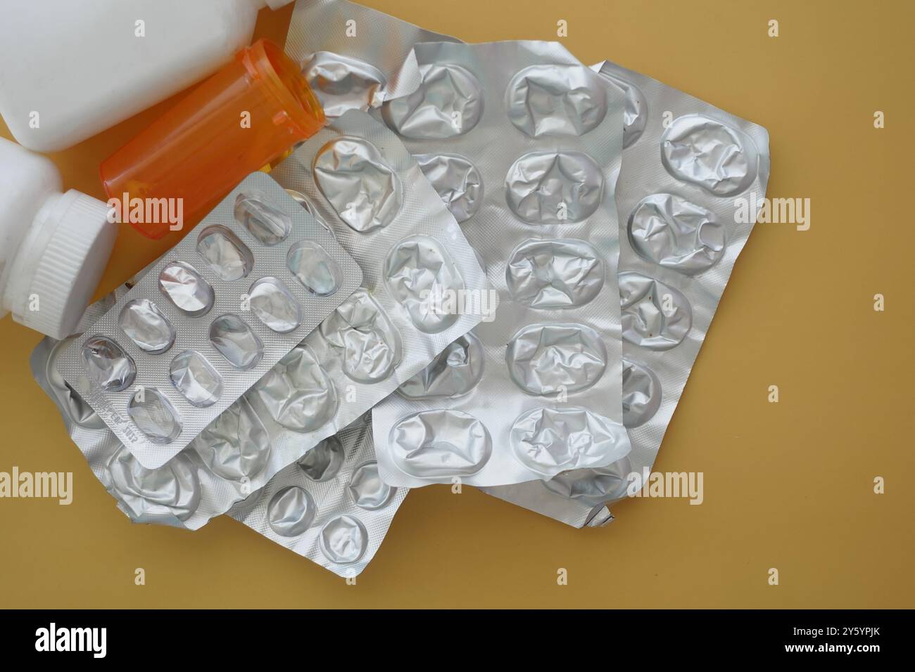A variety of assorted empty medicine blister packs and pill bottles ...