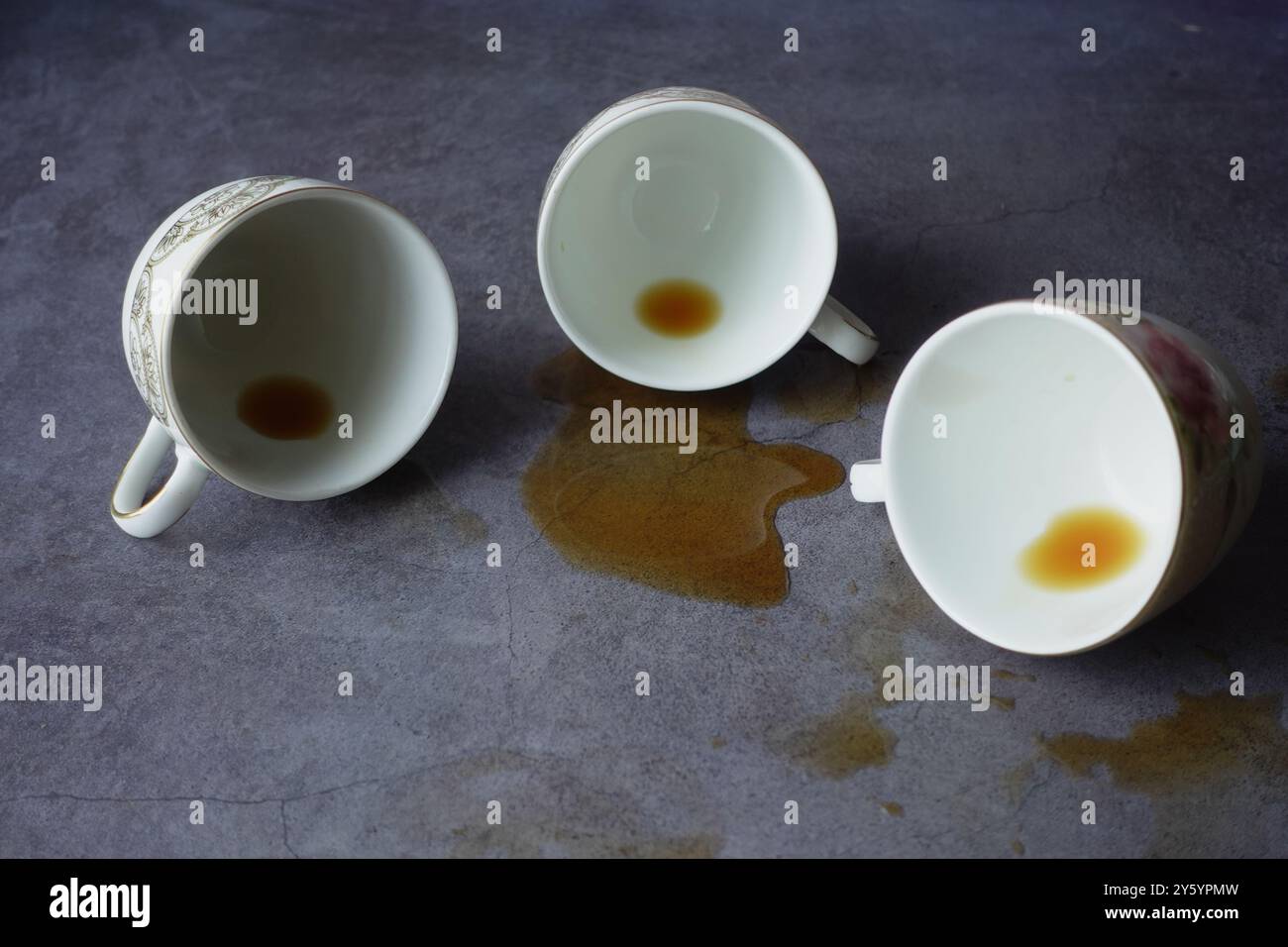 Spilled Tea An Artistic Arrangement Featuring Three Empty and ...