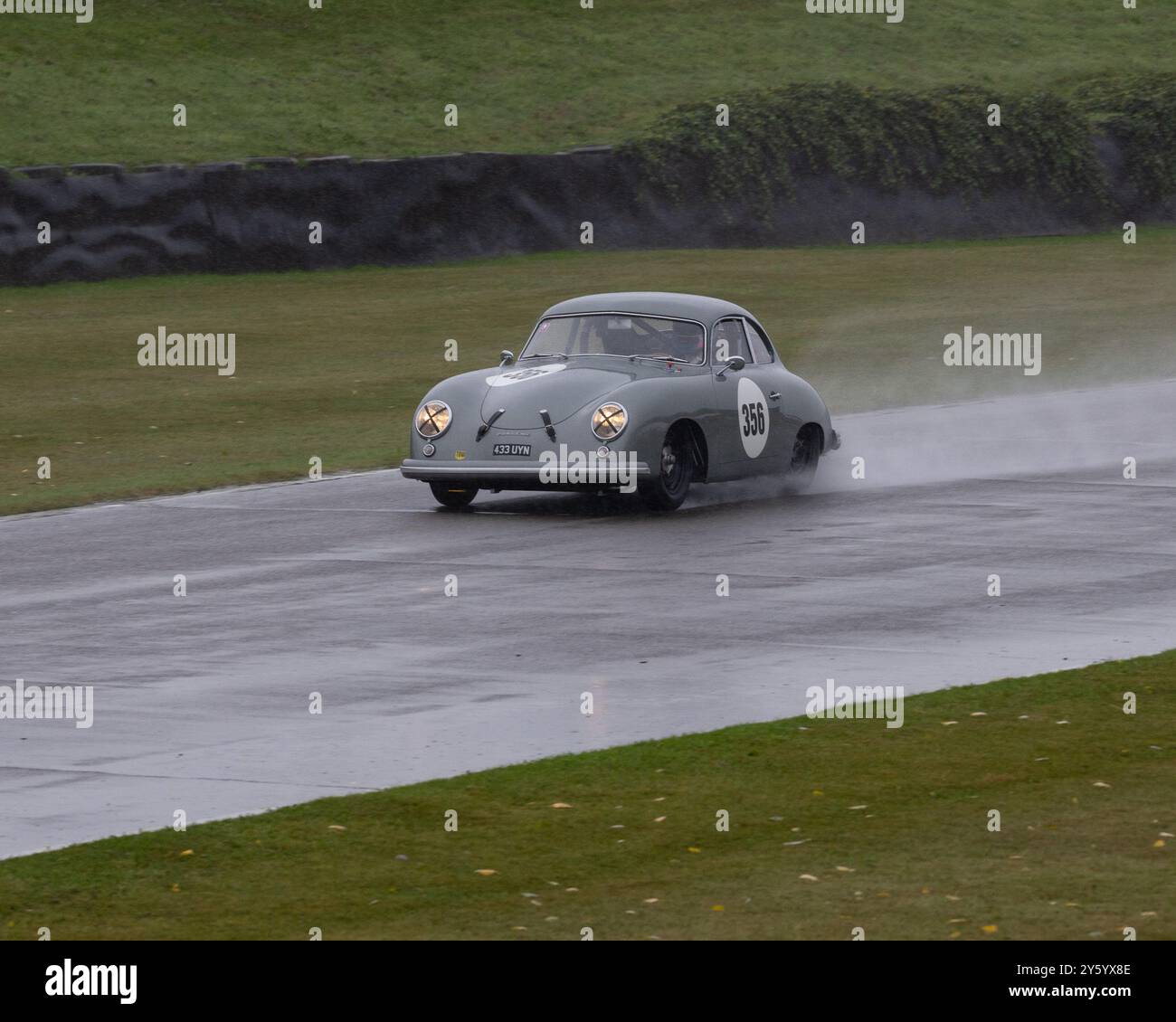 1953 Porsche 356 Roadster racing in the rain and spray at the 2024 ...