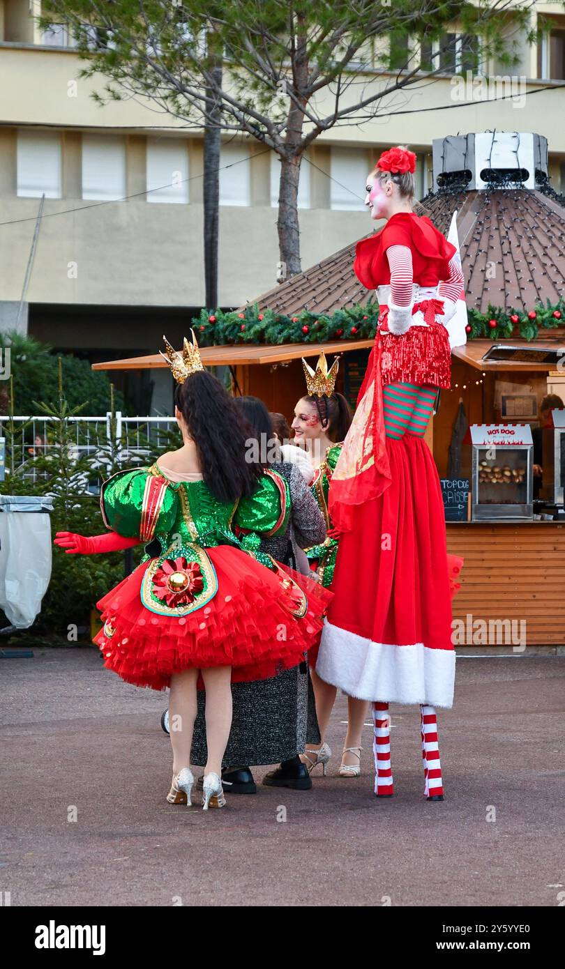 A wader and other costumed characters welcome tourists to the Christmas ...