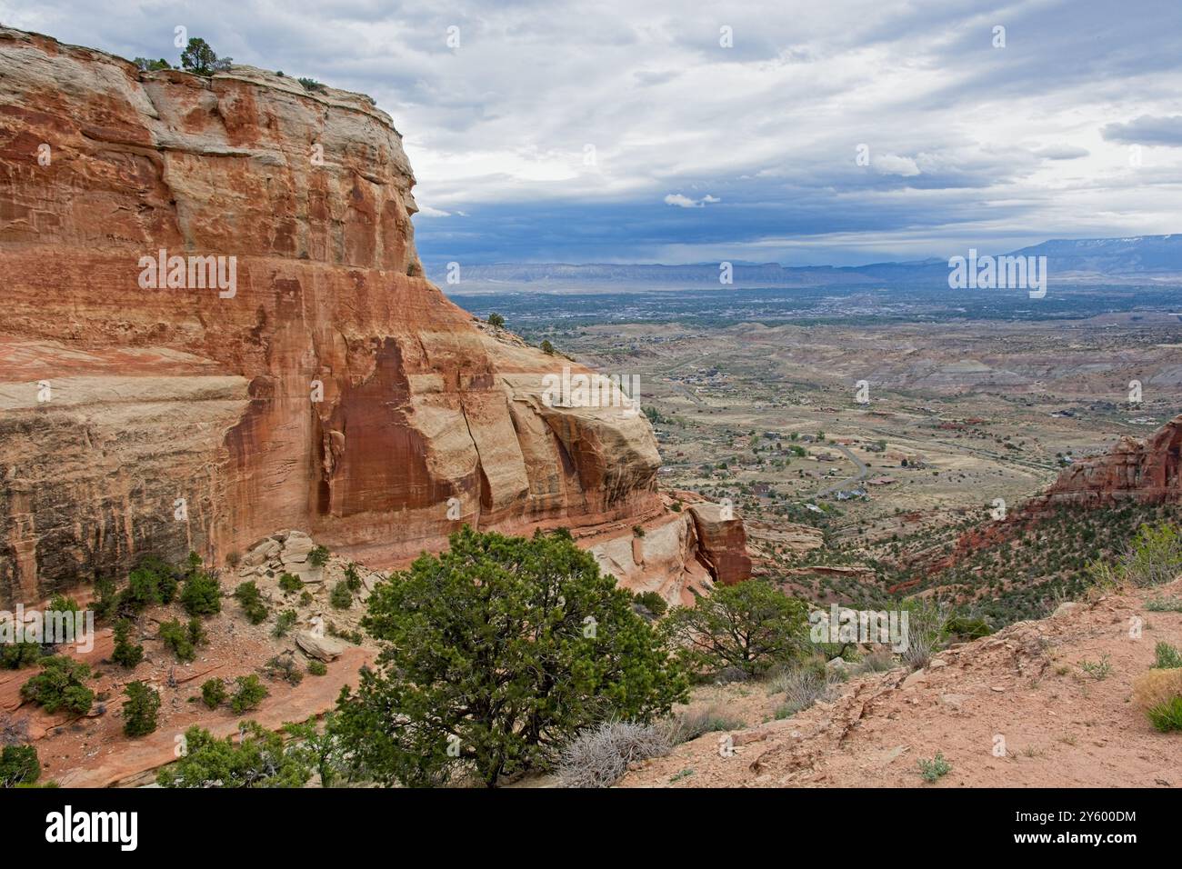 Red sandstone canyon walls frame view of Grand Valley east of Colorado ...