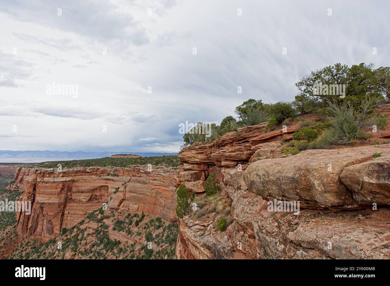 View of shear sandstone cliffs on rim of Ute canyon in Colorado ...