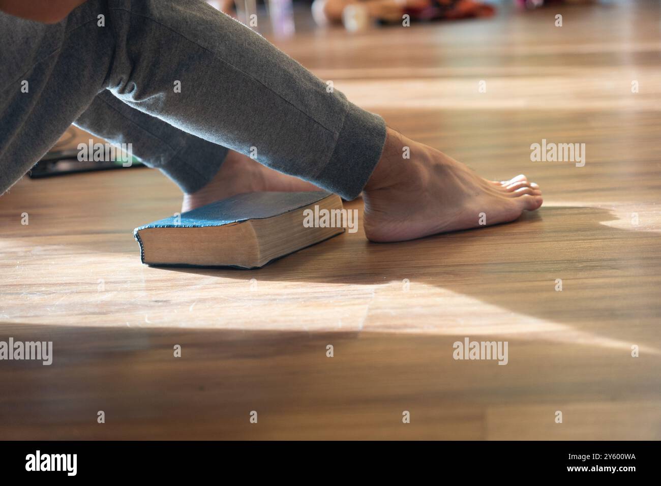 prayer session bible on floor person sitting feet Stock Photo - Alamy