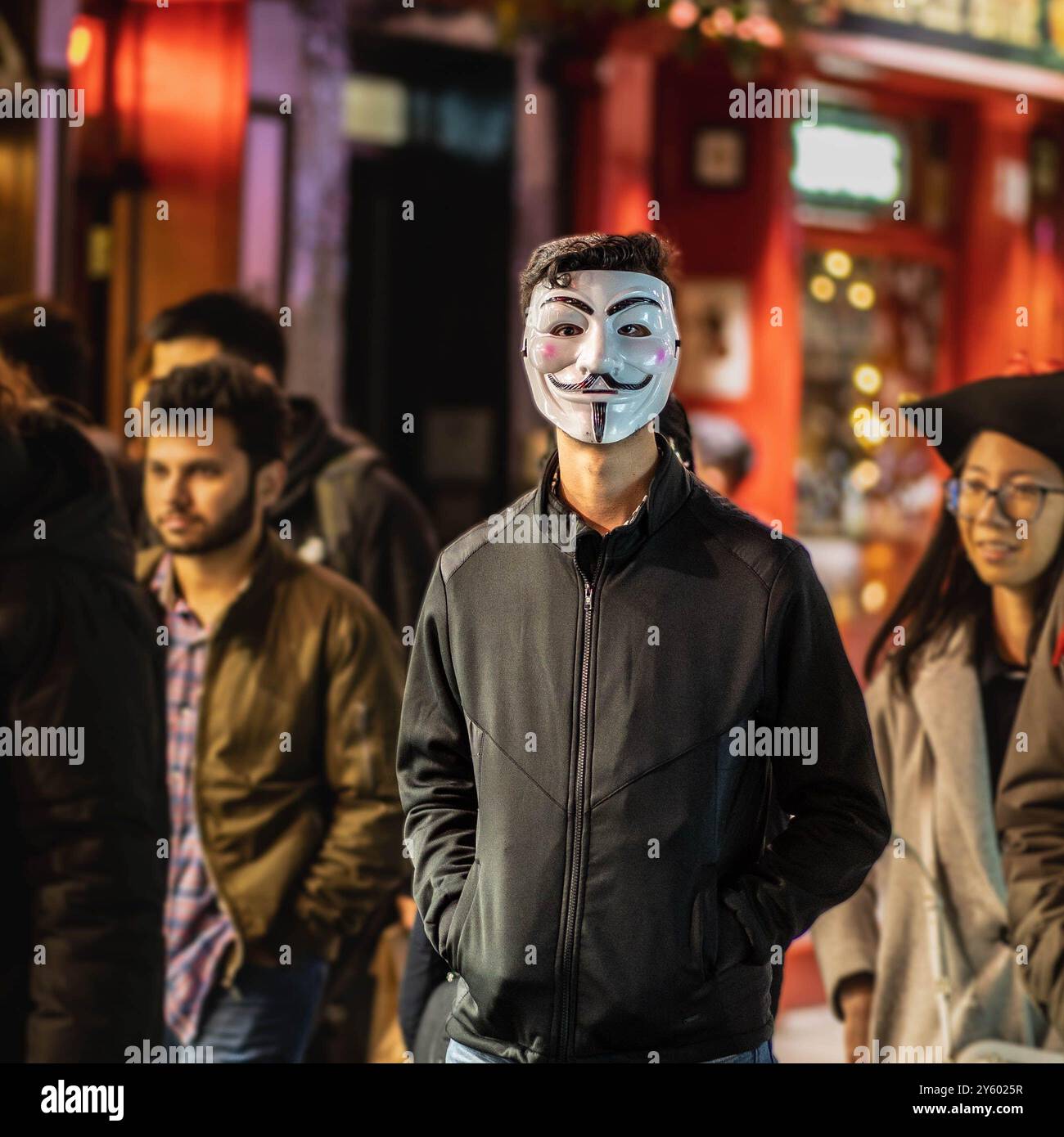 A person wearing V for Vendetta Mask Halloween celebration in with ...