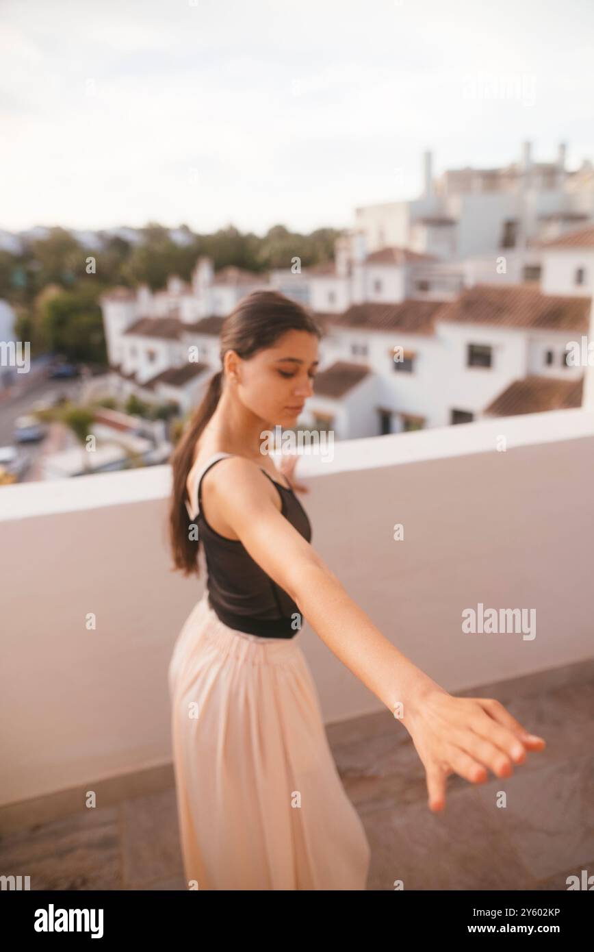 An Elegant Dance Pose Captured Beautifully in a Scenic Balcony Setting ...