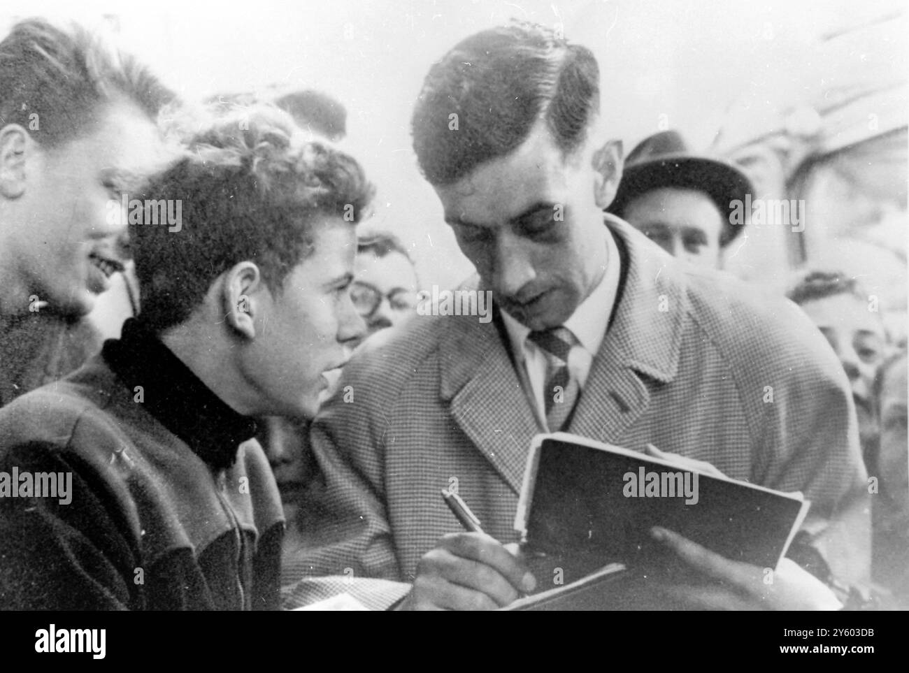 JIMMY ADAMSON SIGNS AUTOGRAPHS 14 MARCH 1961 Stock Photo - Alamy