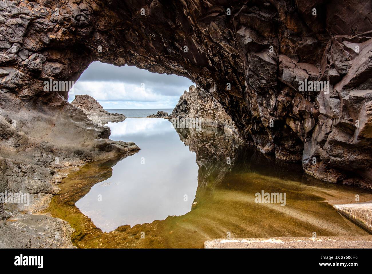 Natural pools of ocean water with sheer cliffs at Seixal Madeira ...