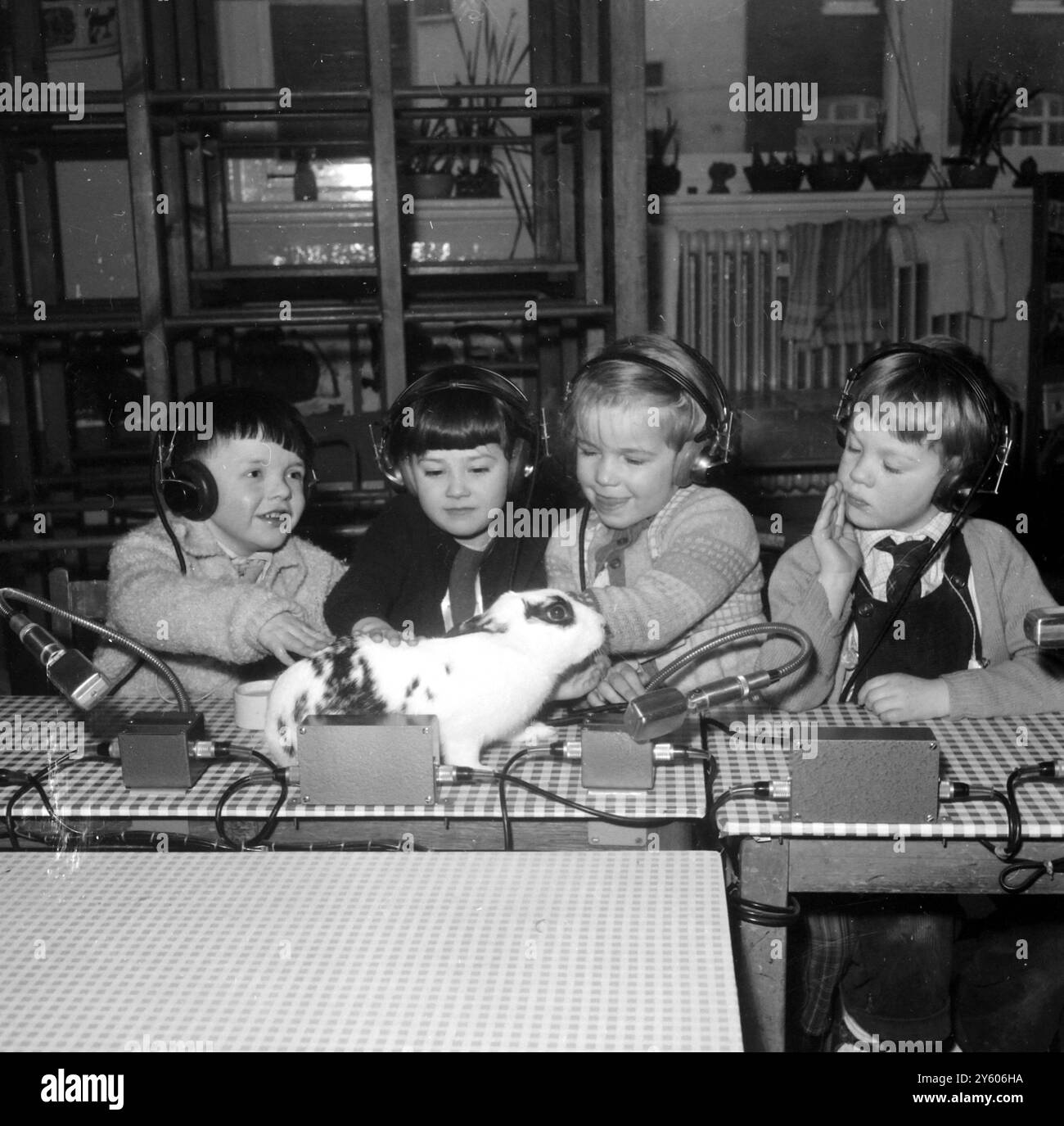DEAF CHILDREN PLAYING WITH RABBIT 20 FEBRUARY 1961 Stock Photo - Alamy