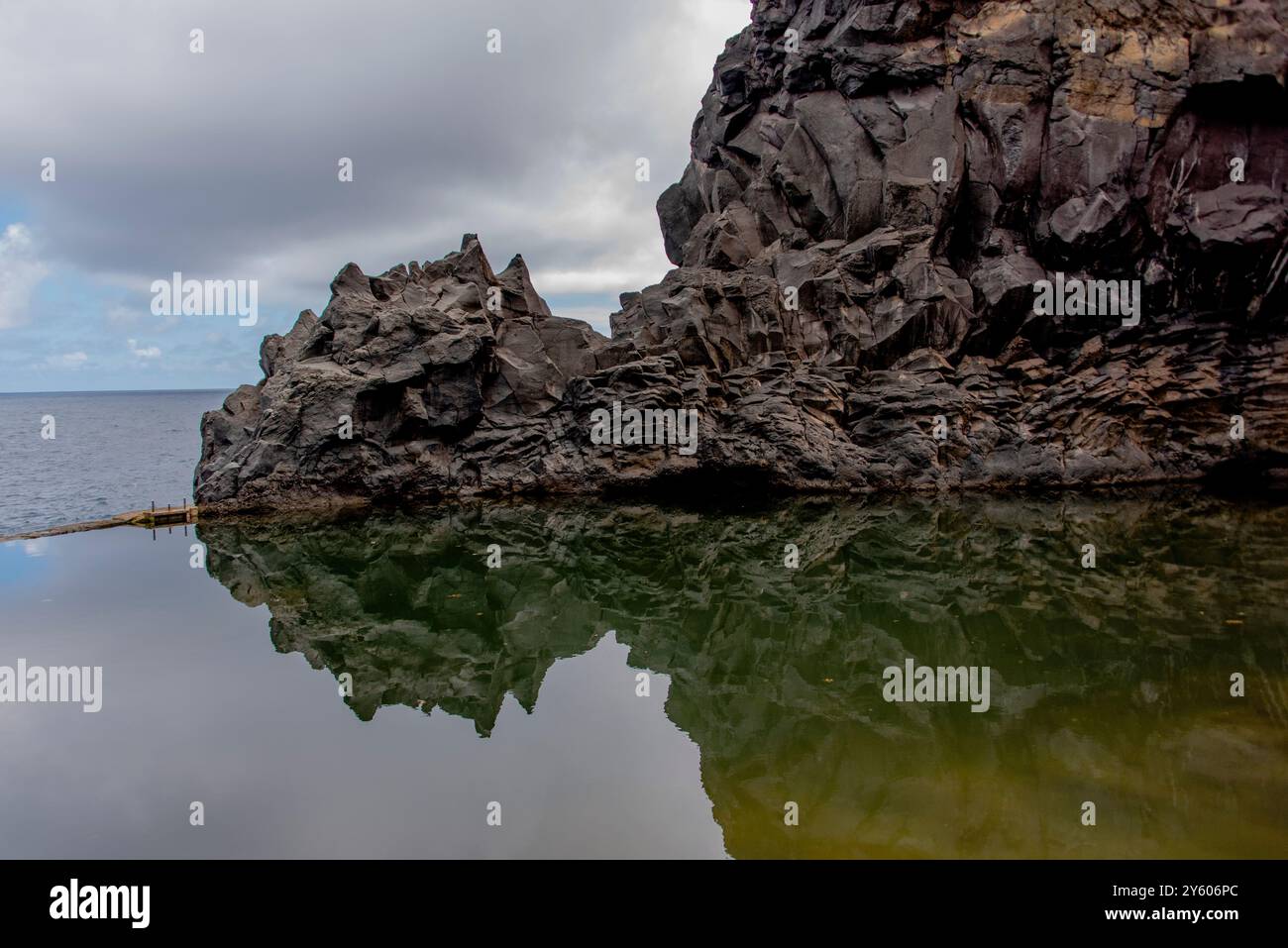 Natural pools of ocean water with sheer cliffs at Seixal Madeira ...