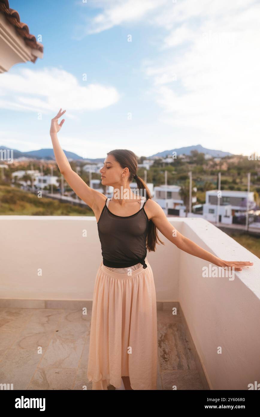 A Graceful and Elegant Dance Pose Captured on a Beautiful Sunny Balcony Overlooking Nature Stock ...