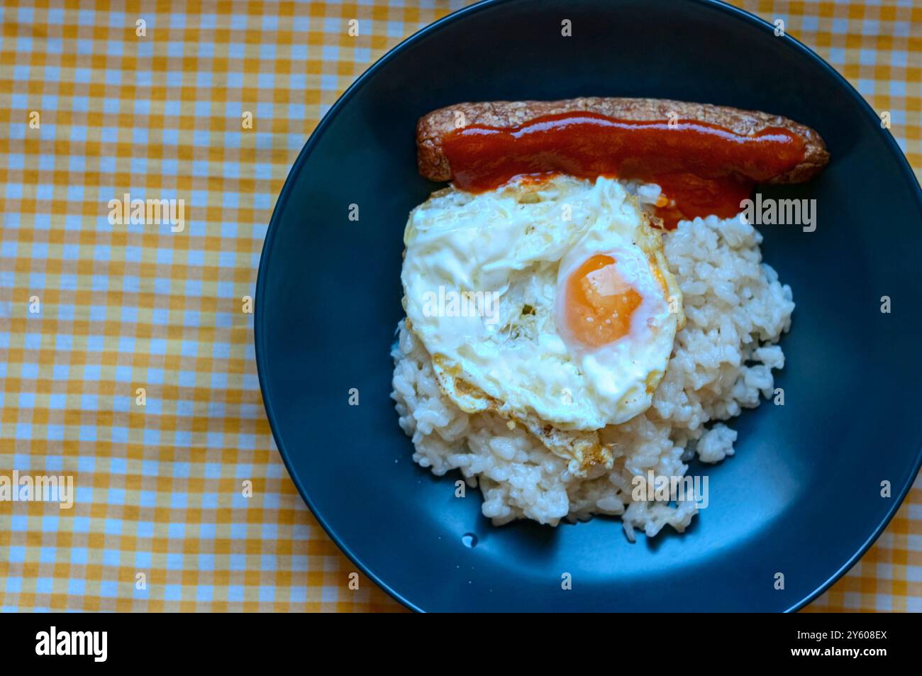 Cuban style rice. With egg, chorizo and spicy tomato Stock Photo - Alamy