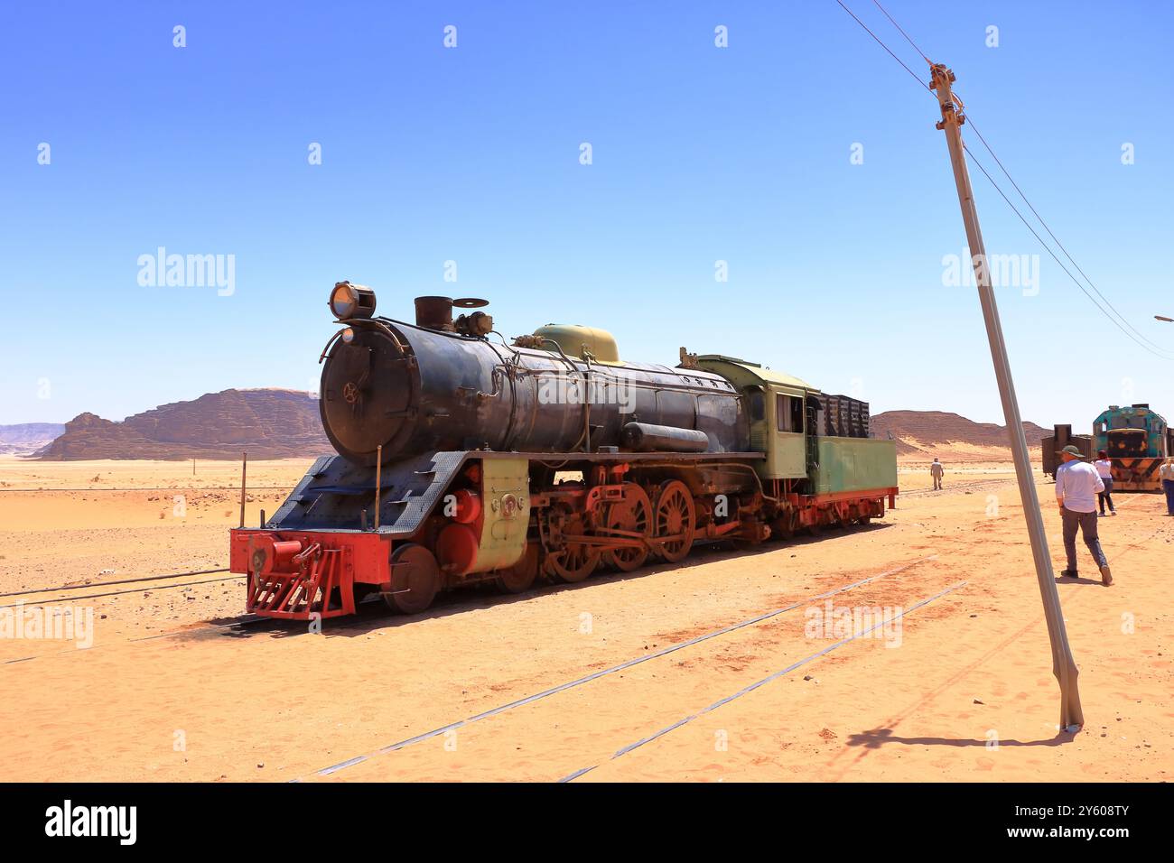 Wadi Rum in Jordan - May 15 2024: people visit the old Locomotive train ...