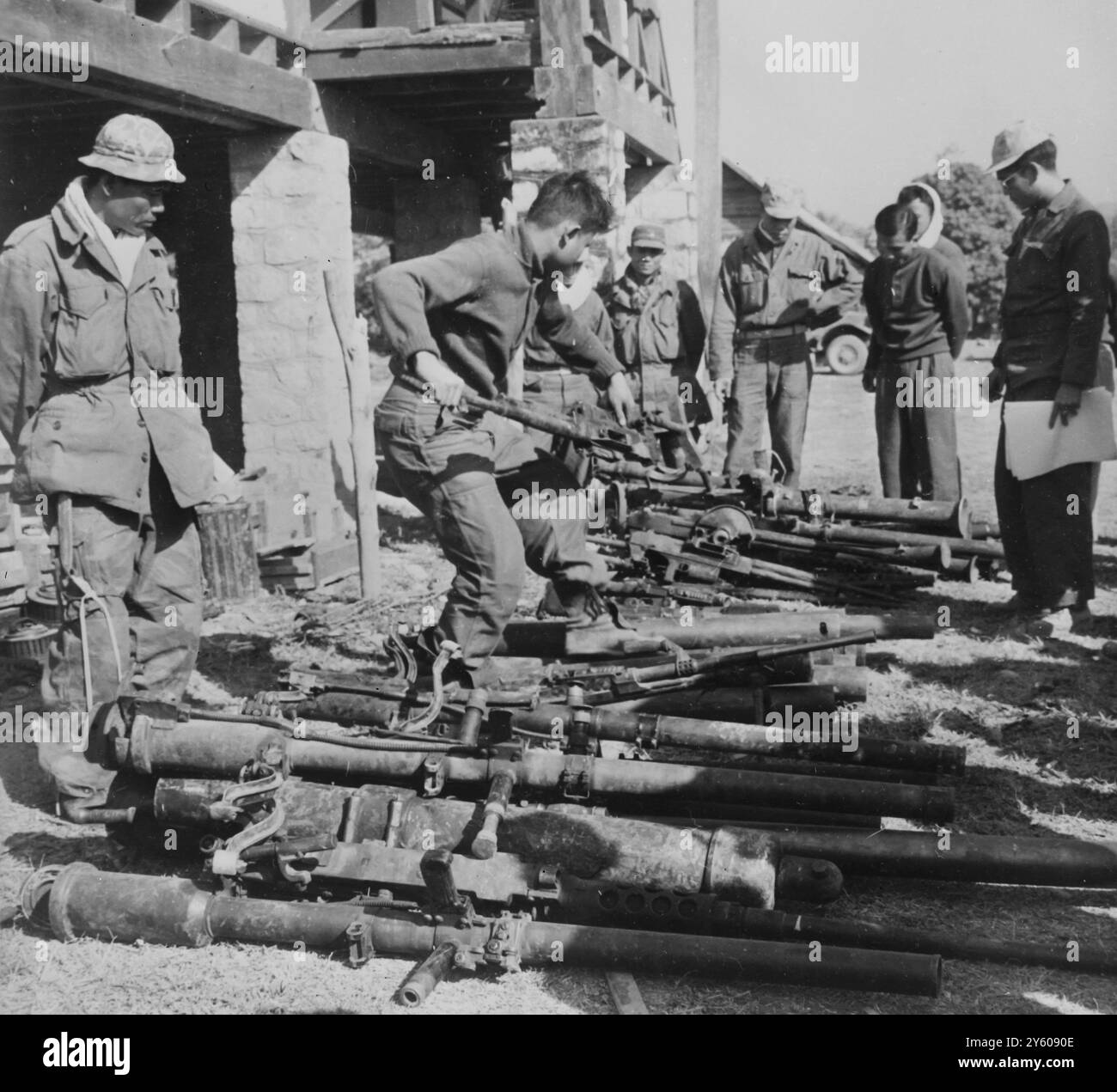 Royal Laotian soldiers examine captured Communist weapons on 30 January ...