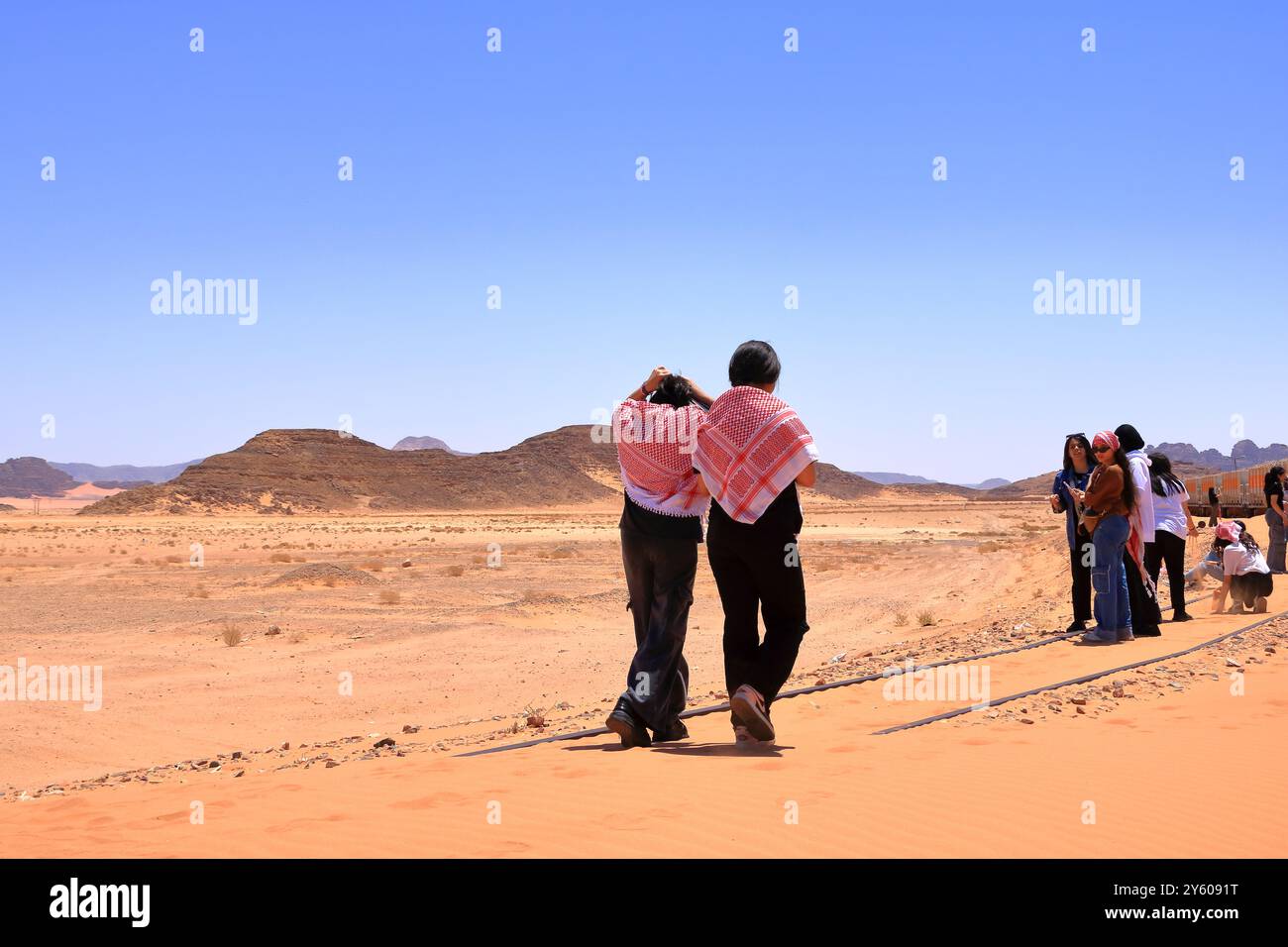 Wadi Rum in Jordan - May 15 2024: people visit old train rails almost ...