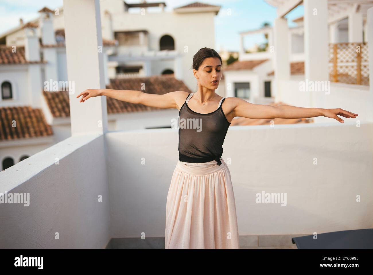 A Graceful Dance Pose Captured on a Scenic Balcony with an Enchanting ...