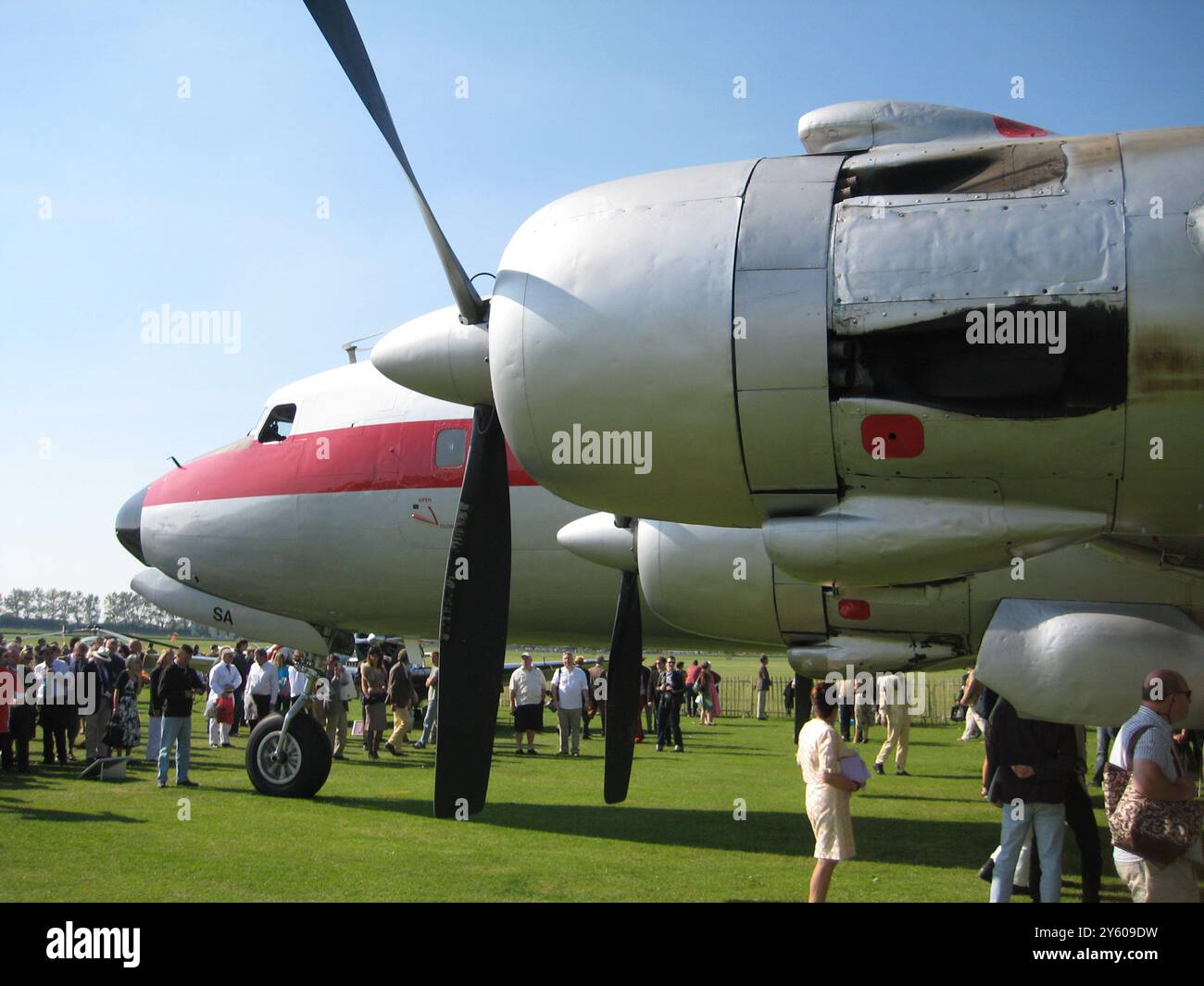 A Vintage aircraft on display at airshow with crowd at Annual Goodwood ...