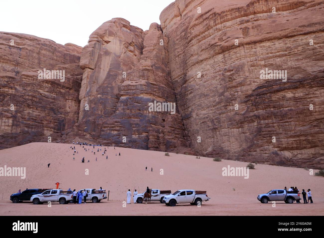 Wadi Rum in Jordan - May 15 2024: people sandboarding on the red sand ...