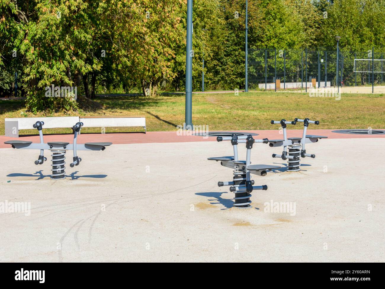 Children's swings balance beams on the playground in the park. Walk in ...