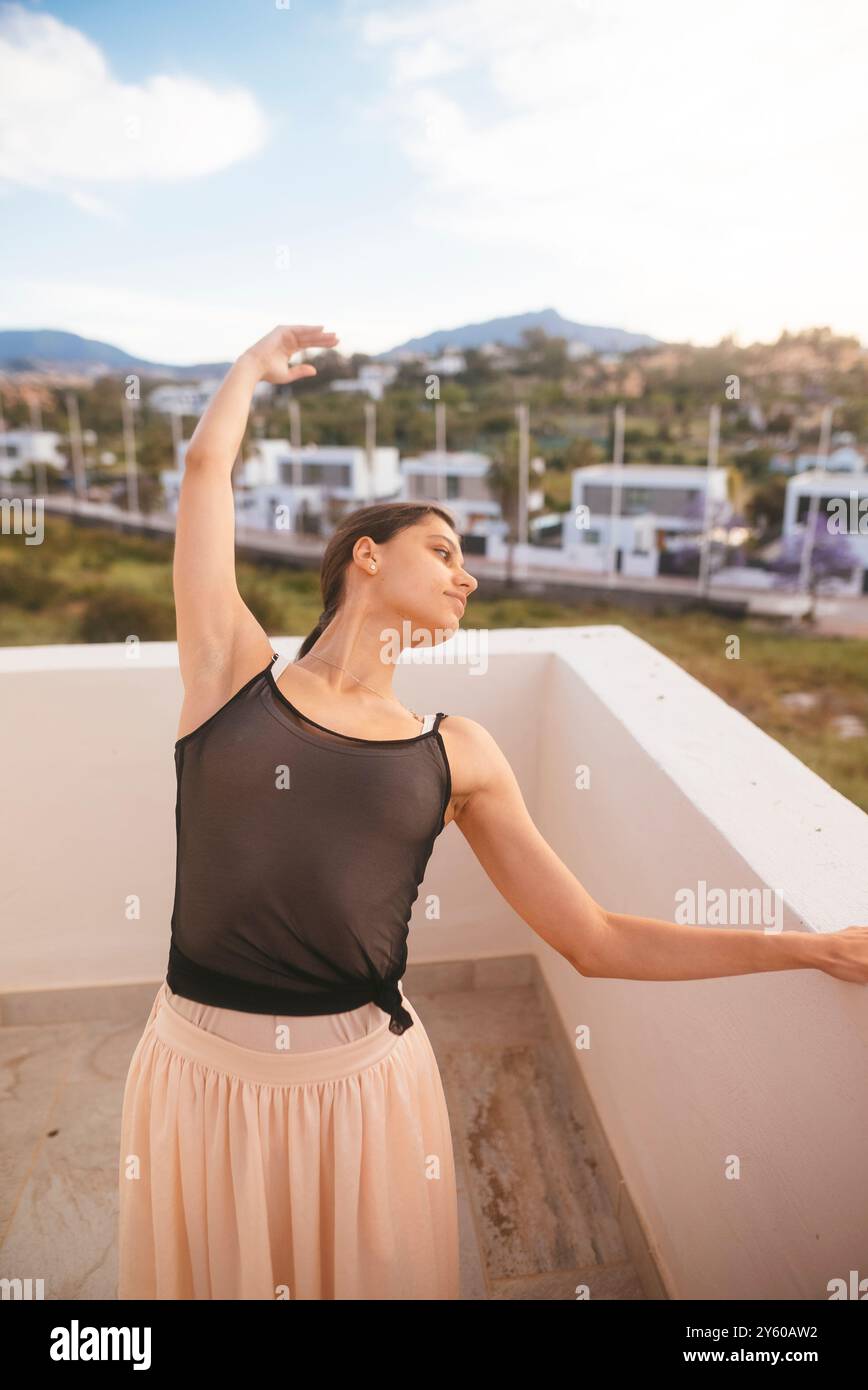 An Elegant Dance Pose Captured on a Stunning Modern Balcony with ...