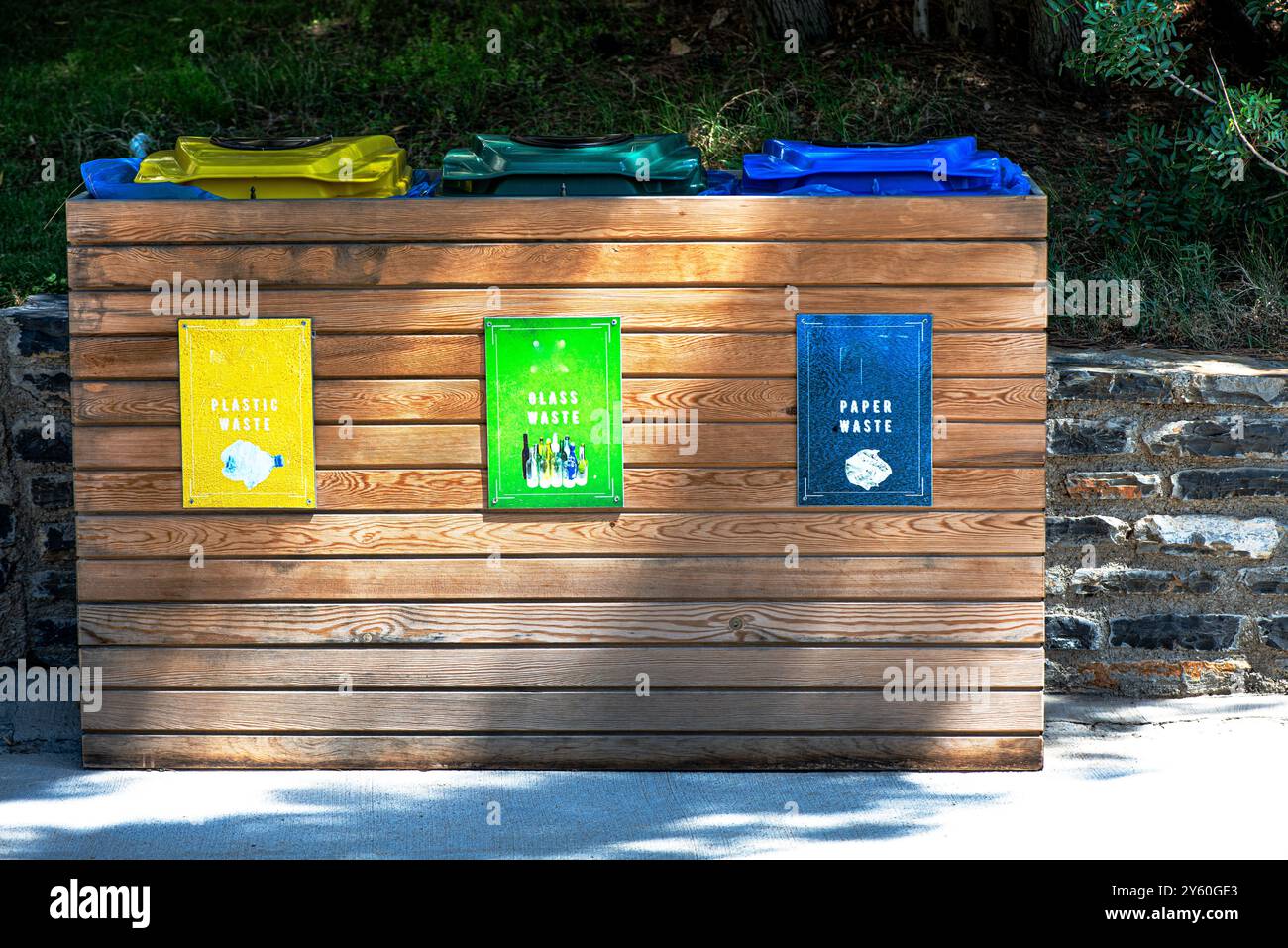 A photograph showing a mixture of discarded glass bottles, plastic ...