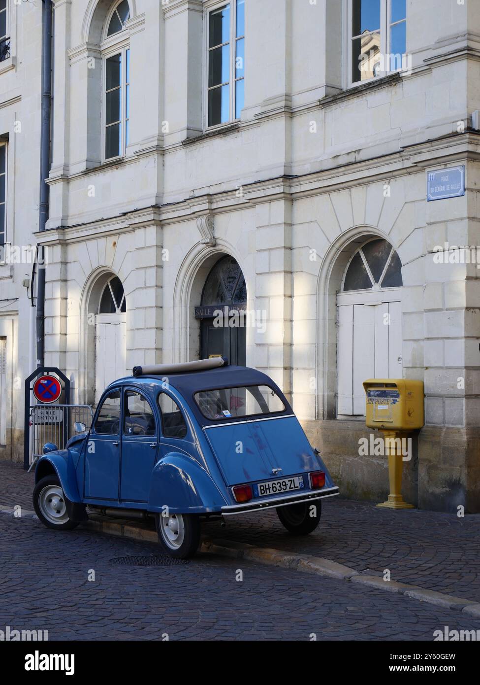 A street in France with iconic Citroen 2CV car and French post box ...