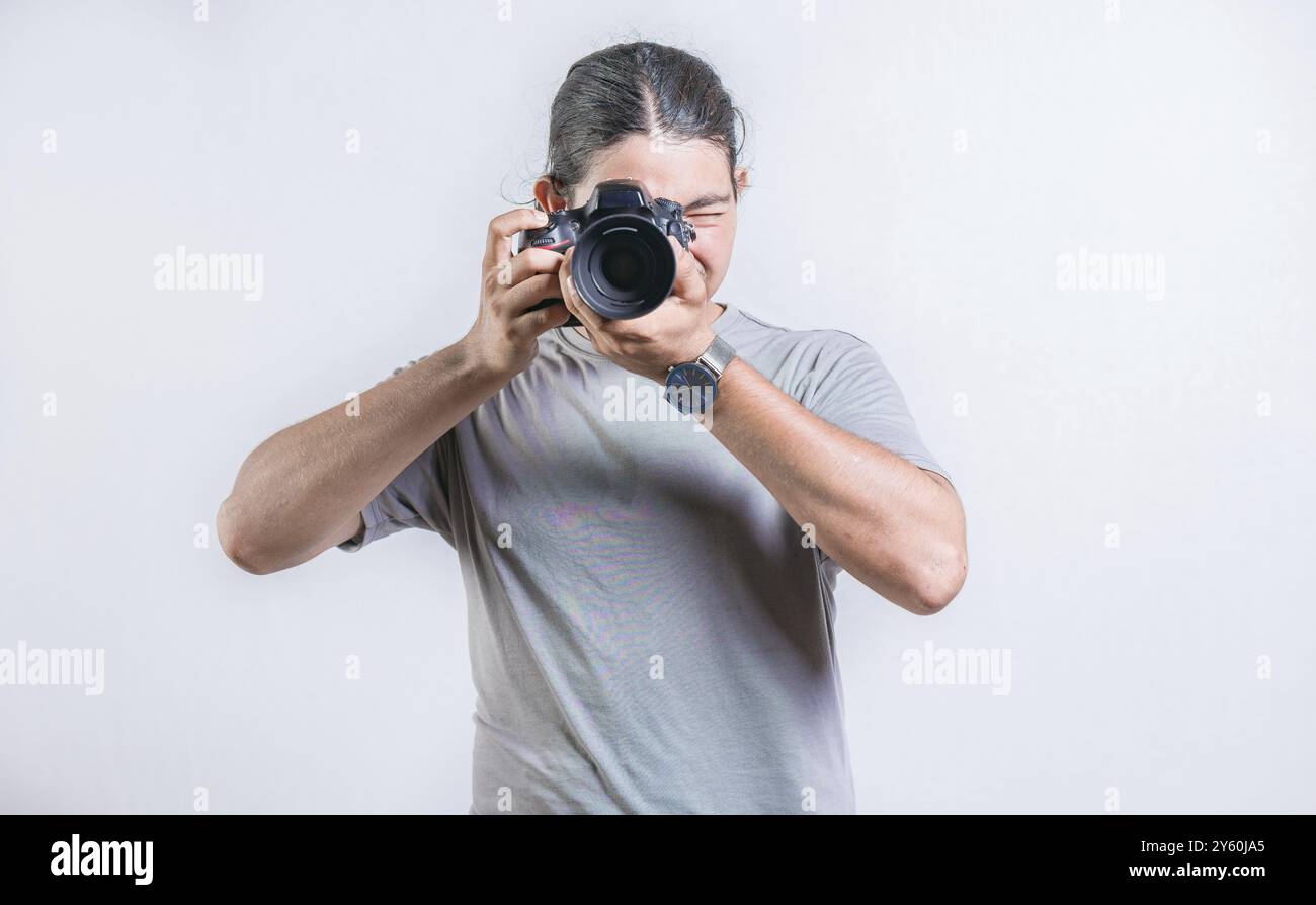 Portrait of handsome photographer taking photos at you isolated. Male ...