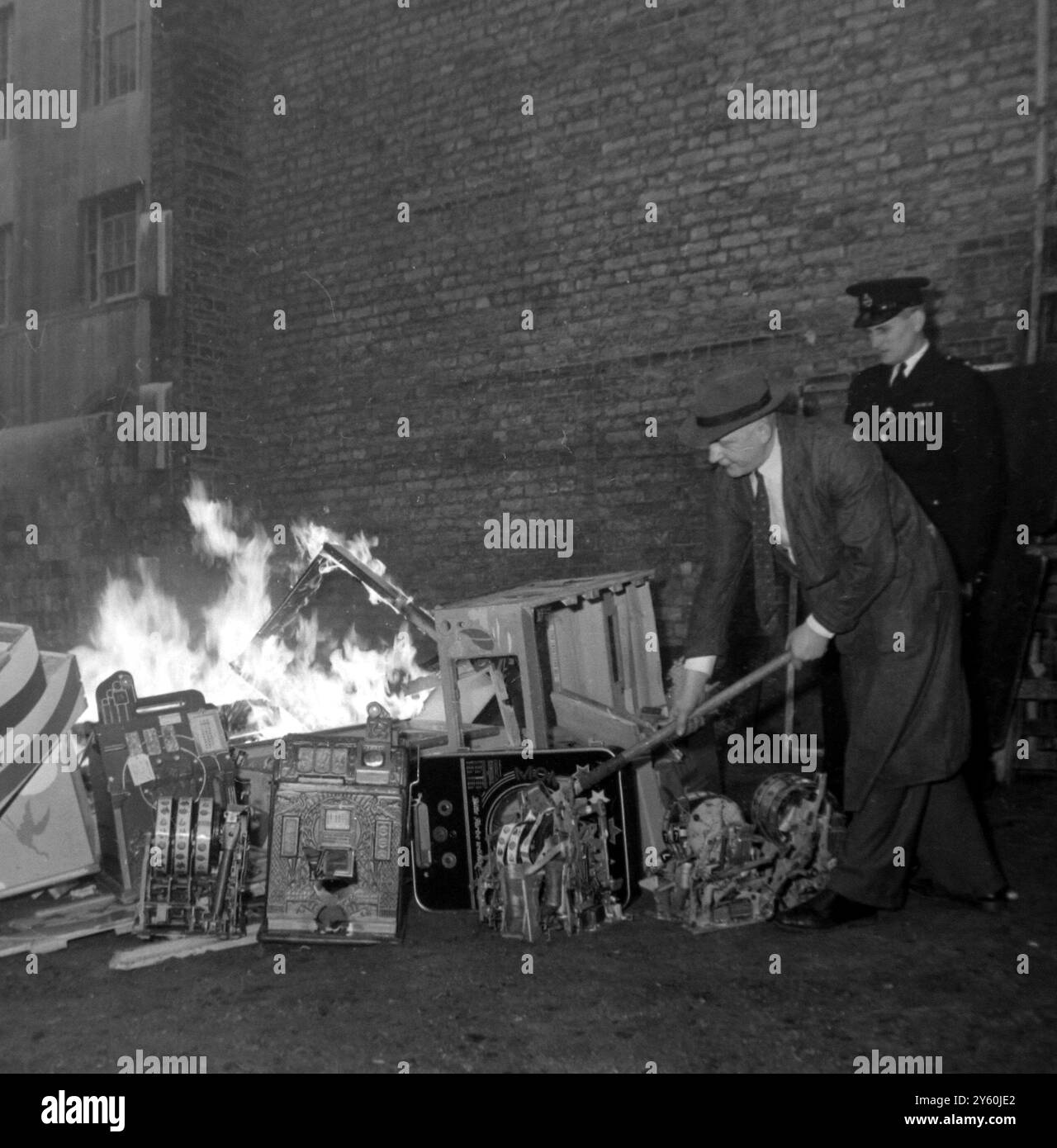 MACHINERY POLICE INSP OVERSEEING DESTRUCTION OF ONE ARM BANDITS 6 ...