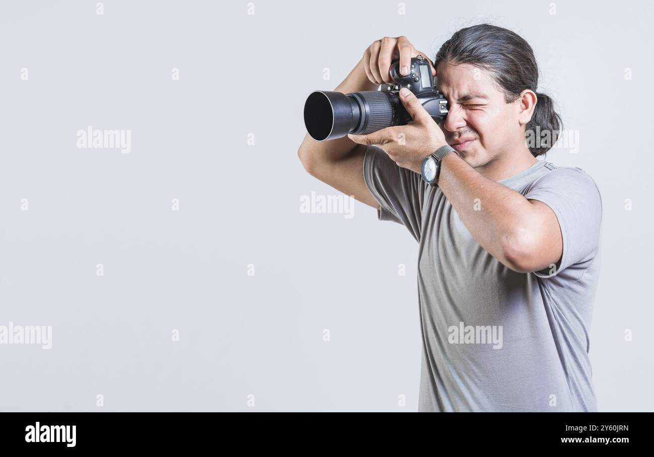 Male photographer taking photos isolated. Handsome photographer taking ...