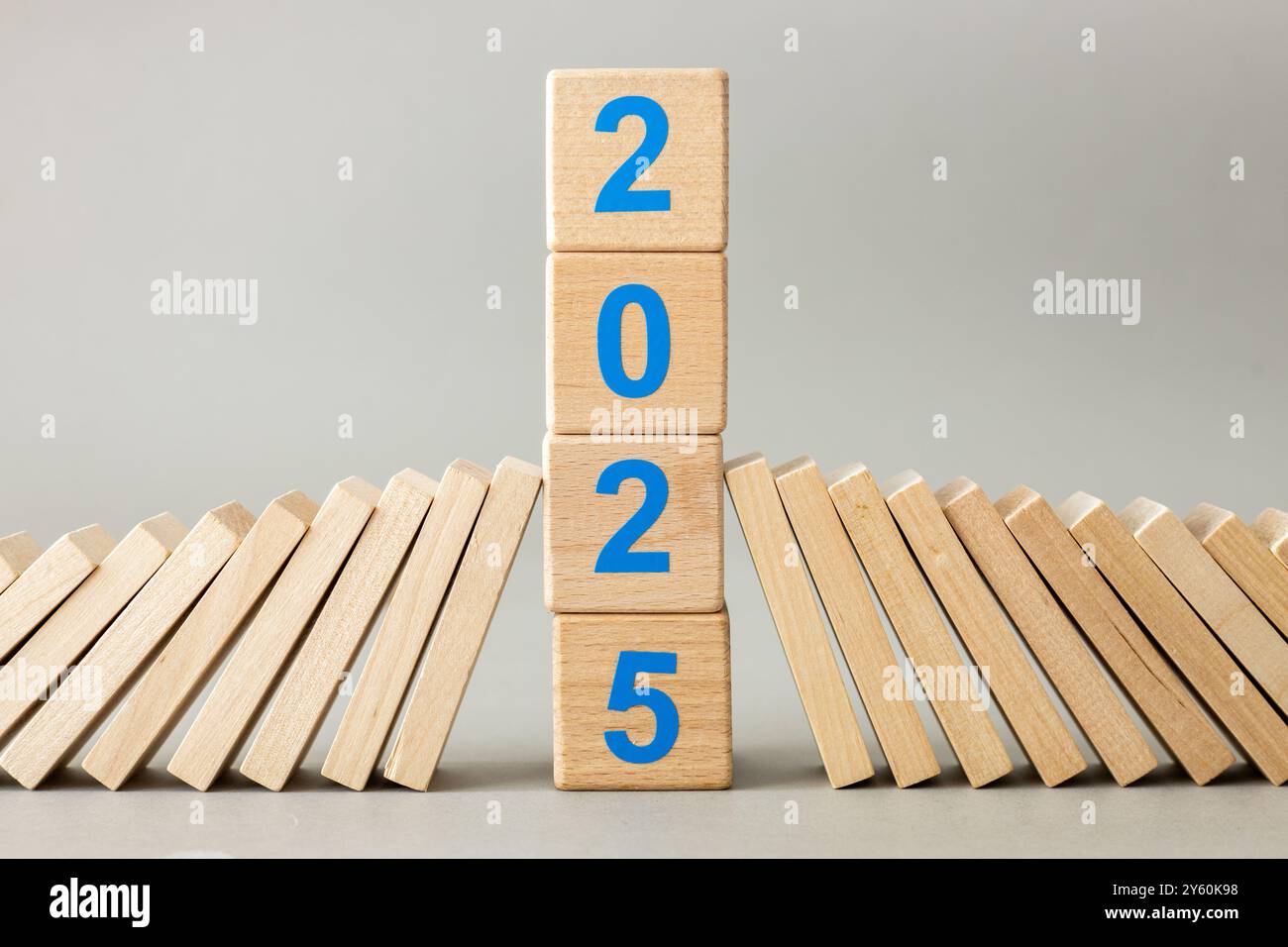 Year 2025. Stopping falling wooden blocks in 2025. Business concept ...
