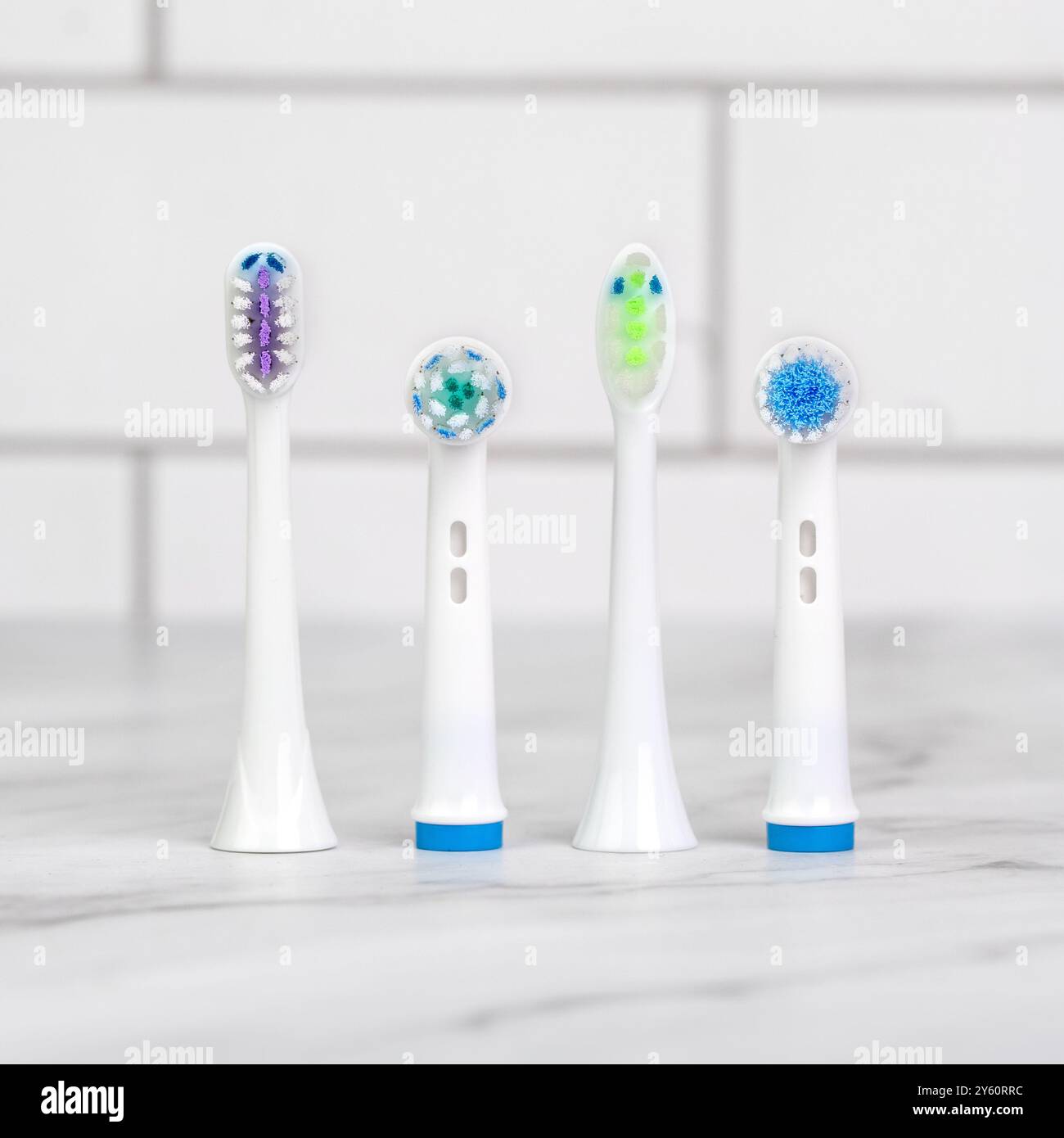 Toothbrushes of different kinds in bathroom Stock Photo - Alamy