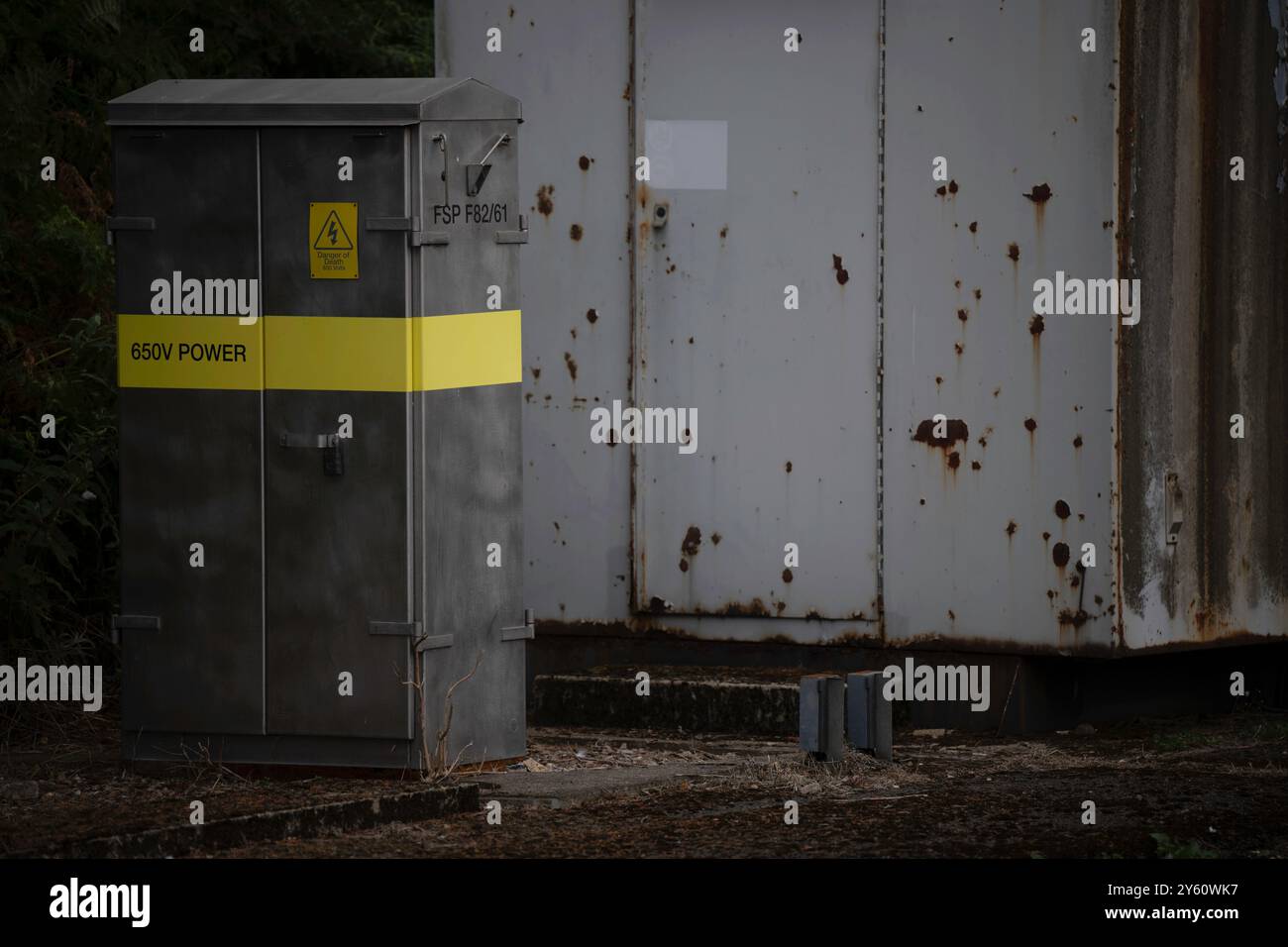 650 volt electricity transformer box beside a railway line Stock Photo ...