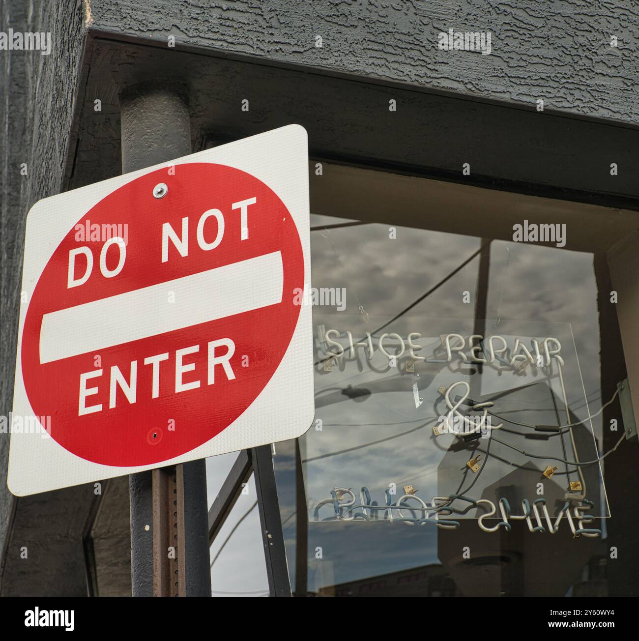 Do Not Enter sign in front of a closed shoe repair store USA 2024 Stock ...