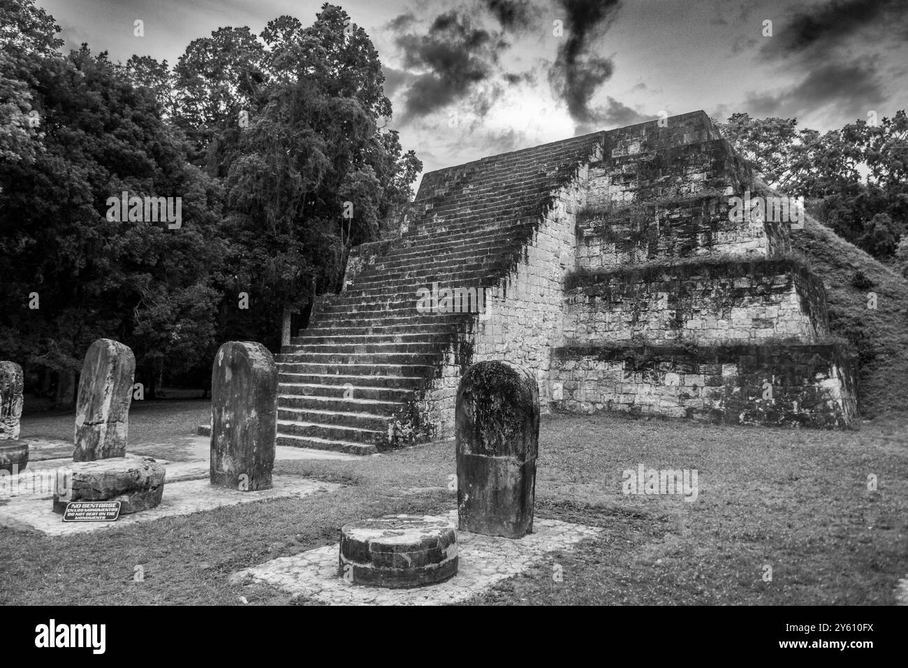 Black and white photo of an ancient Mayan pyramid with stone carvings ...