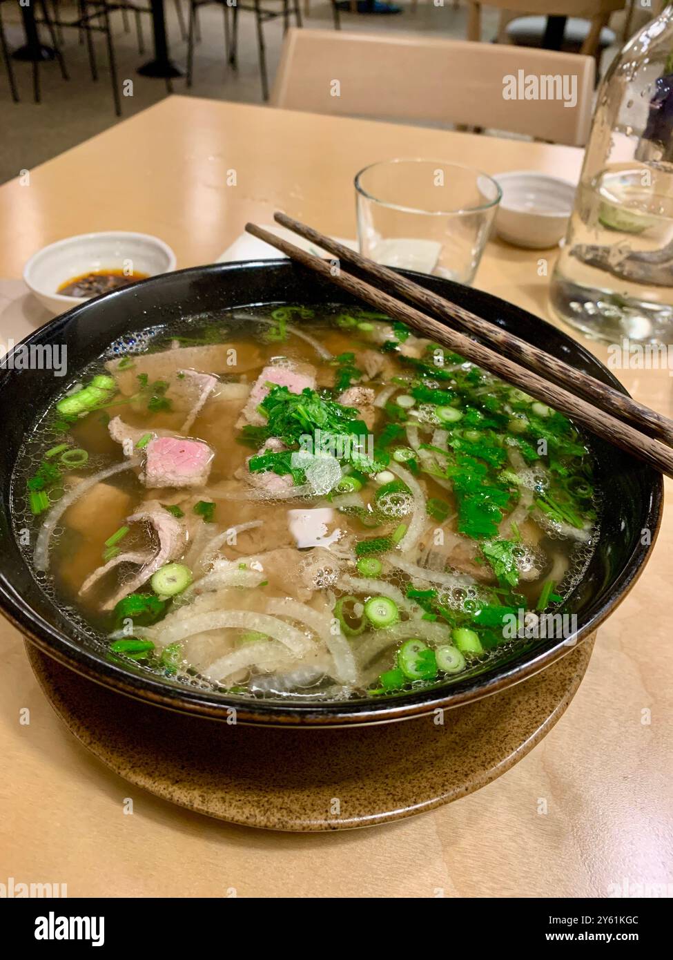 Bowl of freshly prepared Pho Vietnamese soup Stock Photo - Alamy