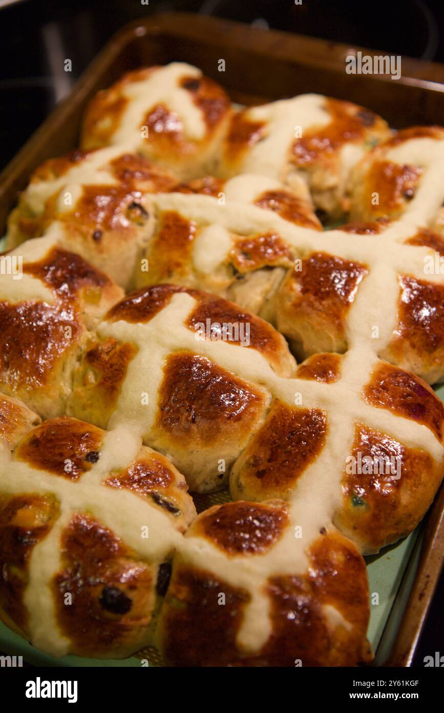 Freshly baked hot Cross Buns on baking sheet Stock Photo - Alamy