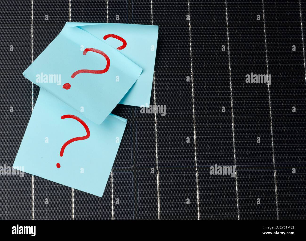 Drawn question marks on stickers, black background. Searching for truth ...