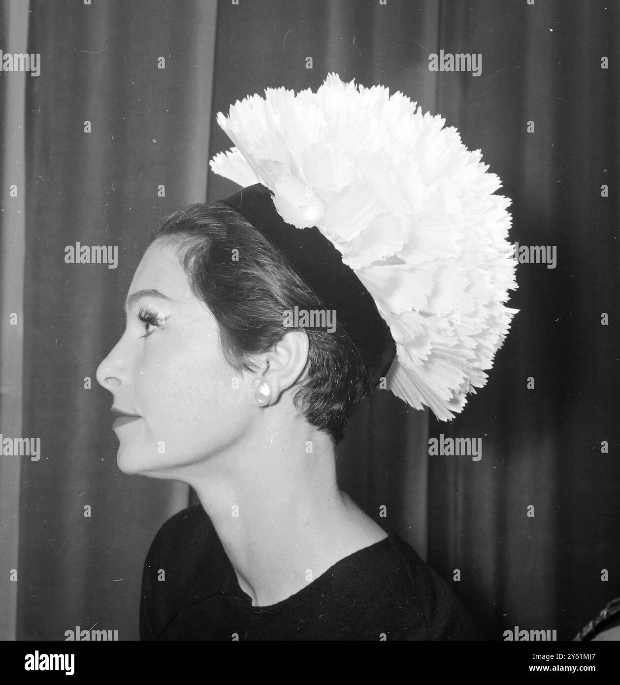 MODEL WEARING A HAT DESIGNED BY SIMONE MIRMAN FOR HER SPRING AND SUMMER ...