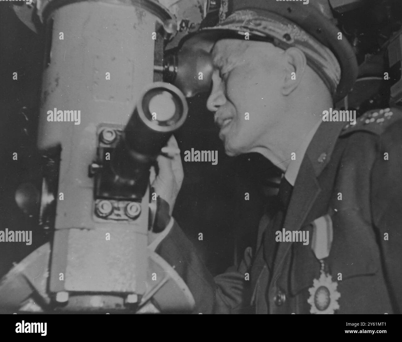 PRESIDENT CHIANG KAI-SHEK LOOKS UP A PERISCOPE ON BOARD THE SUBMARINE ...