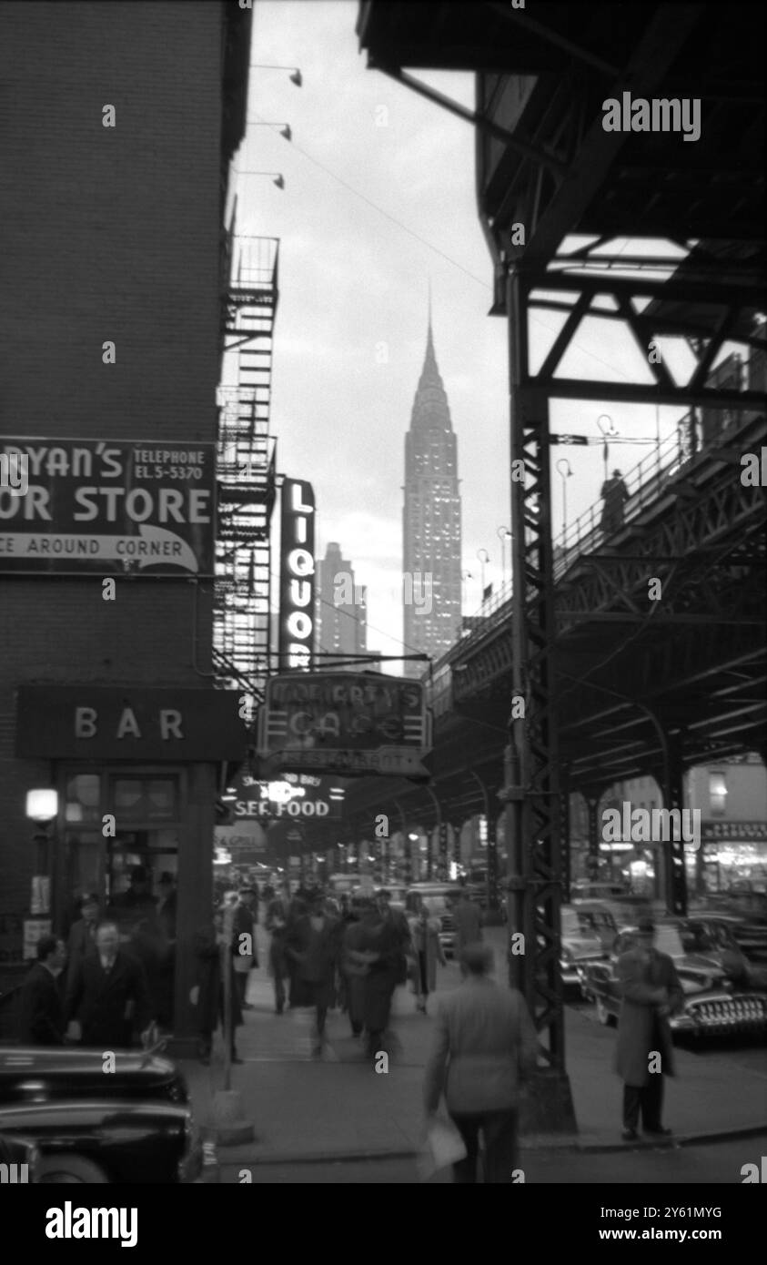Pedestrians and traffic move along New York City streets C. 1952 Stock ...