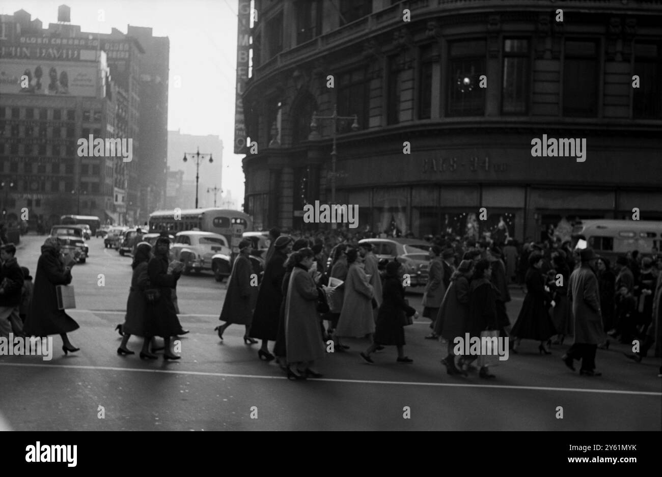Pedestrians and traffic move along New York City streets C. 1952 Stock ...