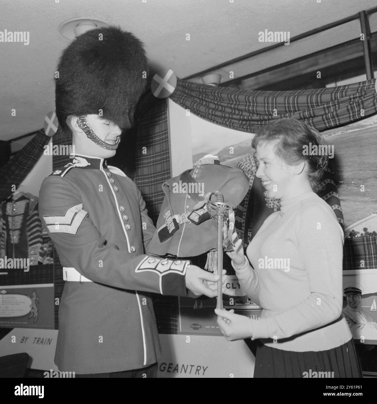 MISS PATRICIA BUNTING LOOKS AT UNIFORM OF CORPORAL ALEX WILSON / 7 ...
