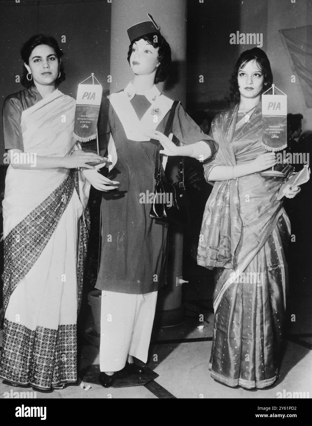 POSING BESIDE A UNIFORMED DUMMY WEARING SARI WEARING PAKISTANI AIRLINE ...