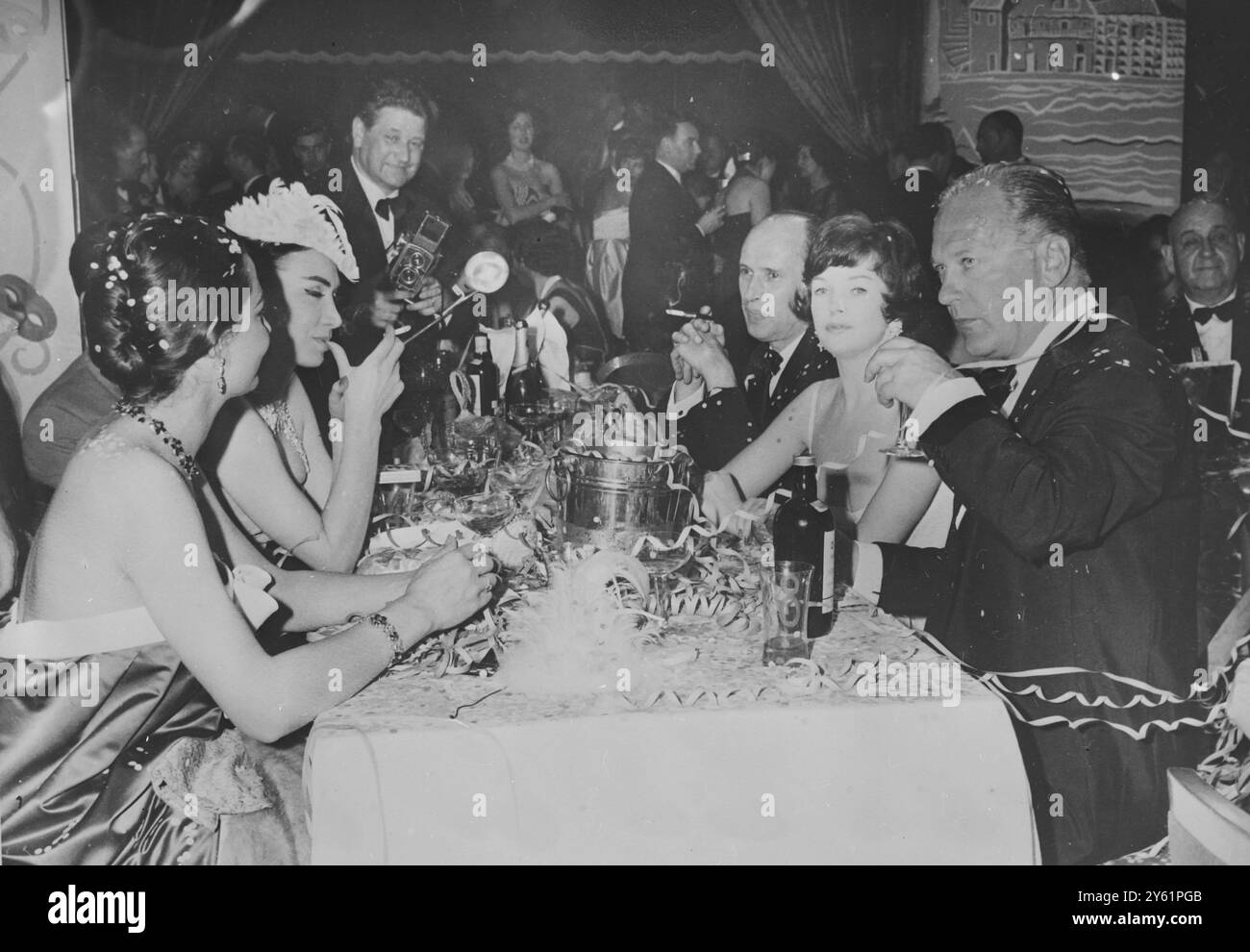 STREAMERS AND CONFETTI COVER PARTYGOERS INCLUDING ACTOR KURT JURGENS ...