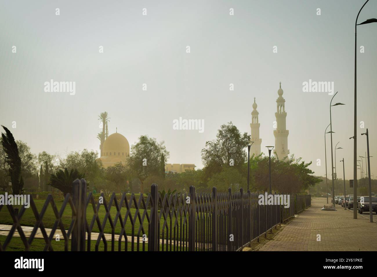 the beautiful lanscape view of mosque and nature park beside road at ...